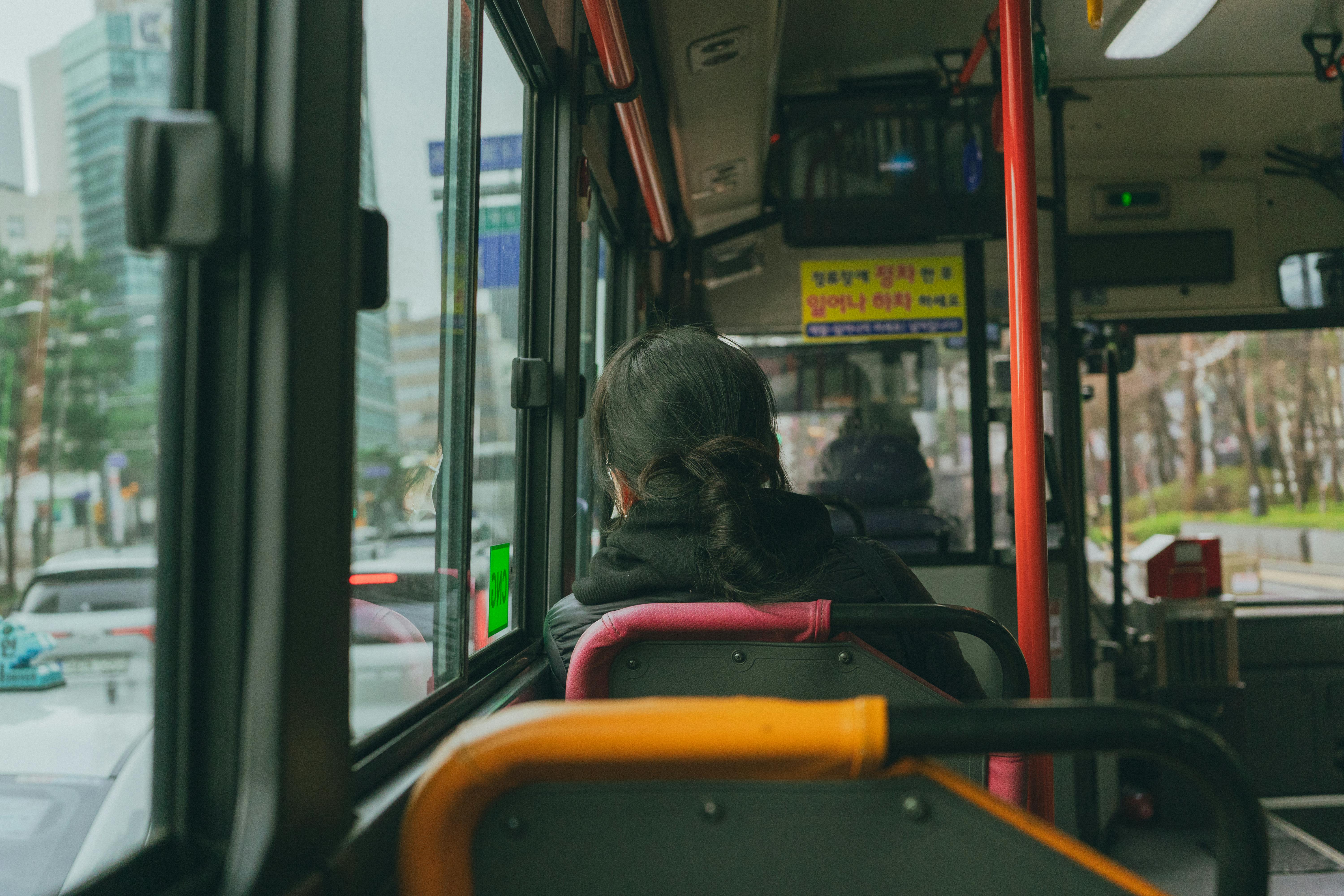 A Commuter Riding a Bus Through Seoul · Free Stock Photo