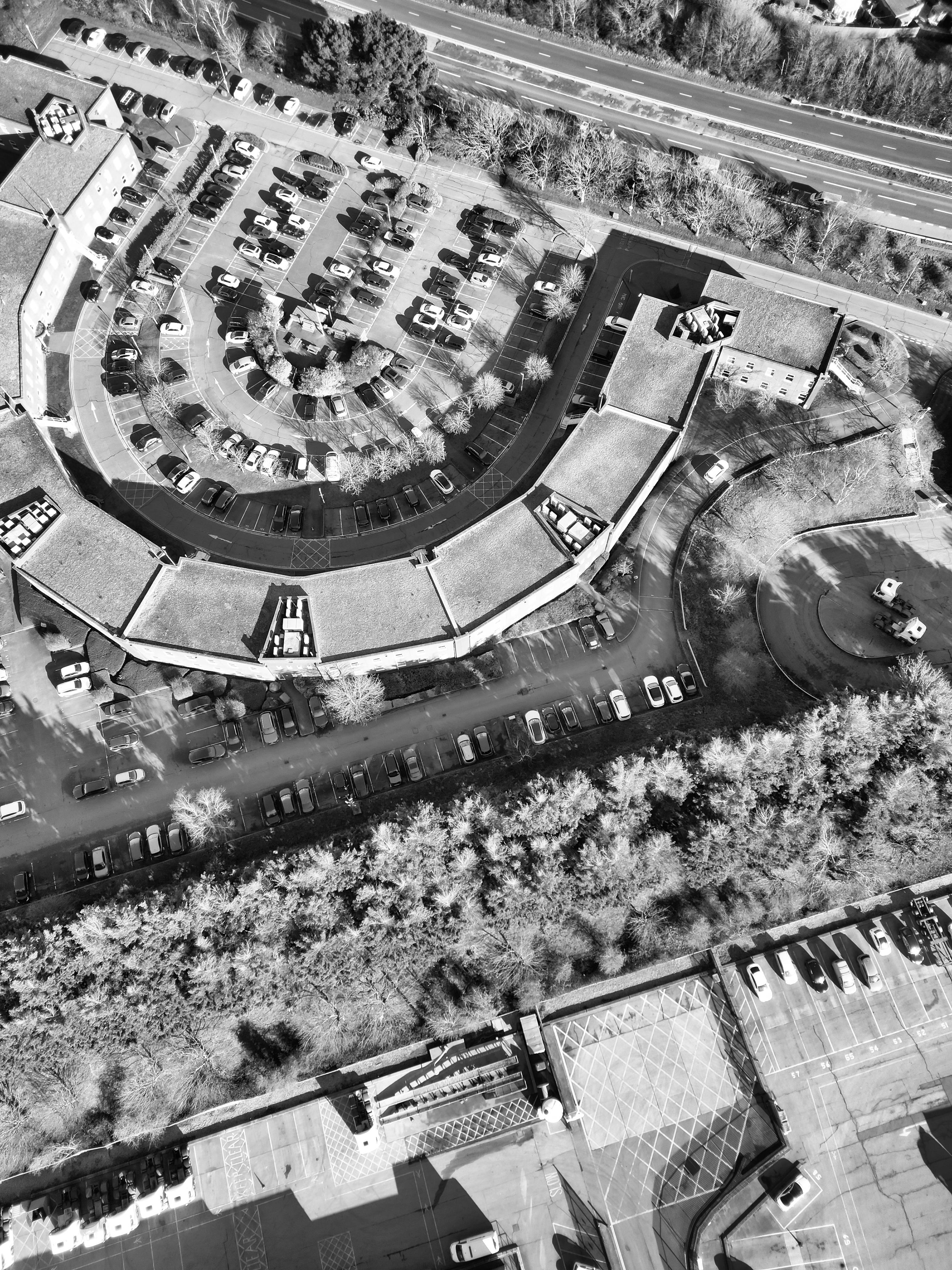 Aerial View of Curved Parking Structure in Black and White · Free Stock ...