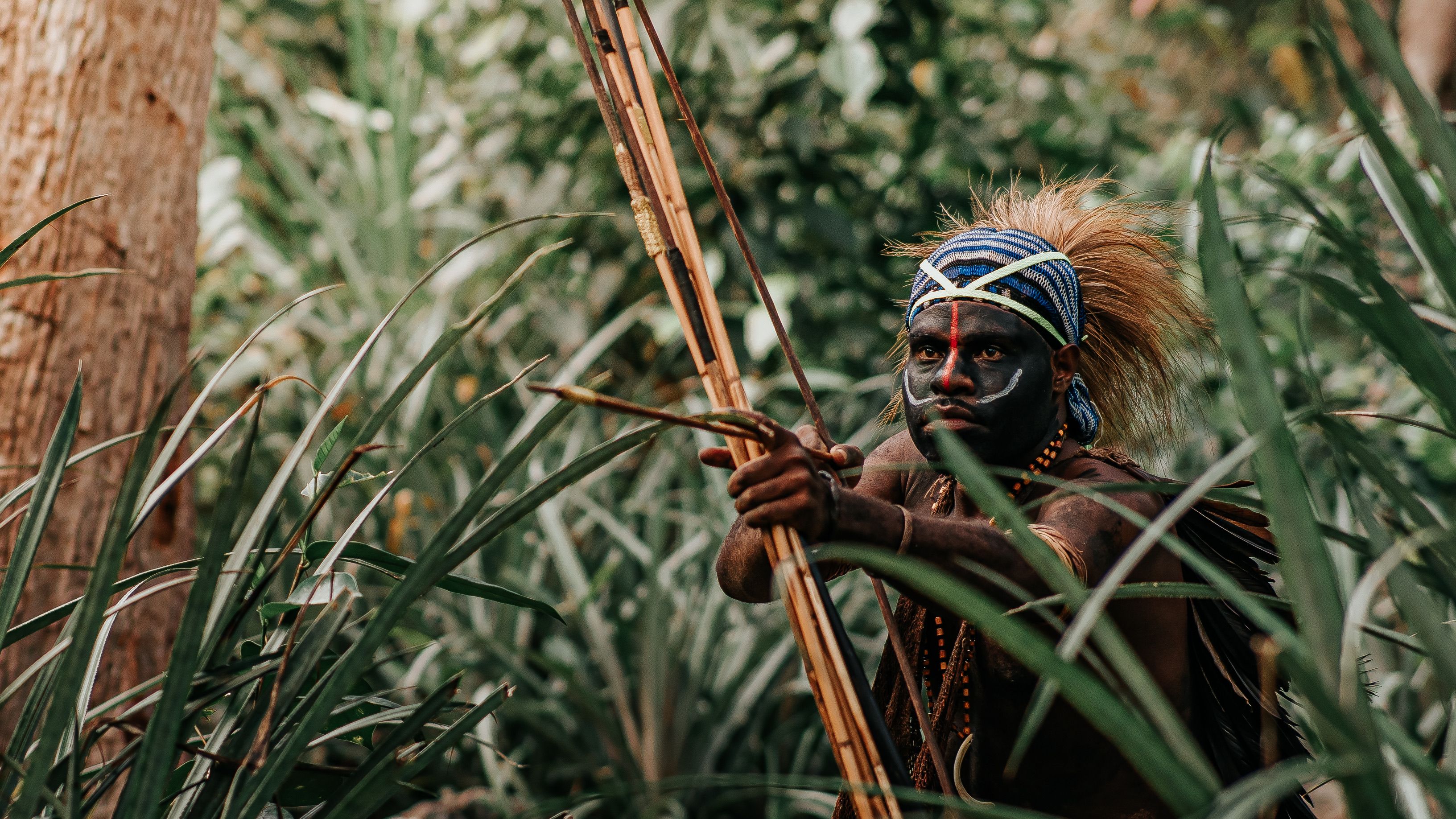 Tribal Warrior in Traditional Attire Outdoors · Free Stock Photo