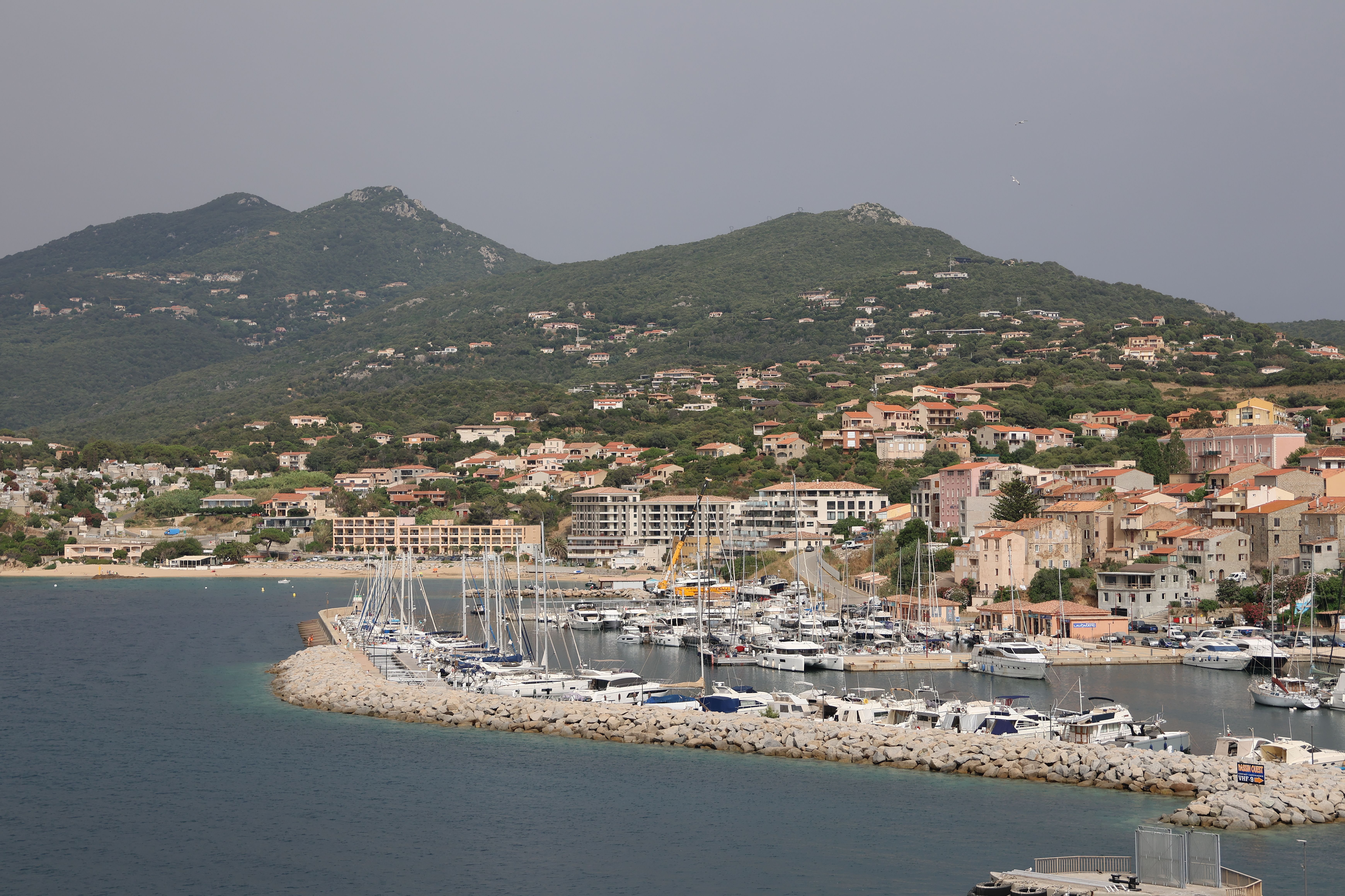 Scenic Port View with Yachts and Hills · Free Stock Photo