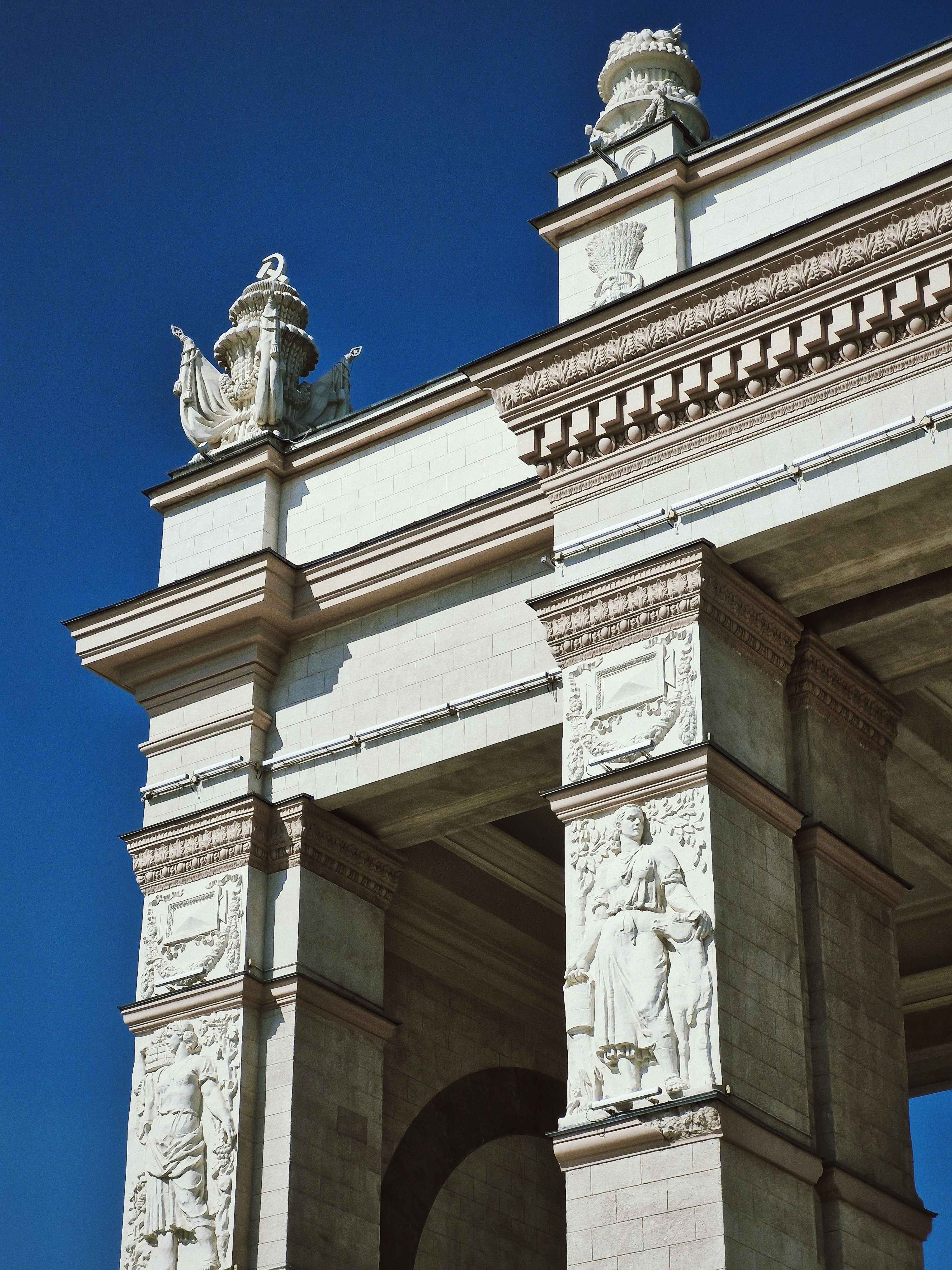 Detailed Architectural Arch Against Blue Sky · Free Stock Photo