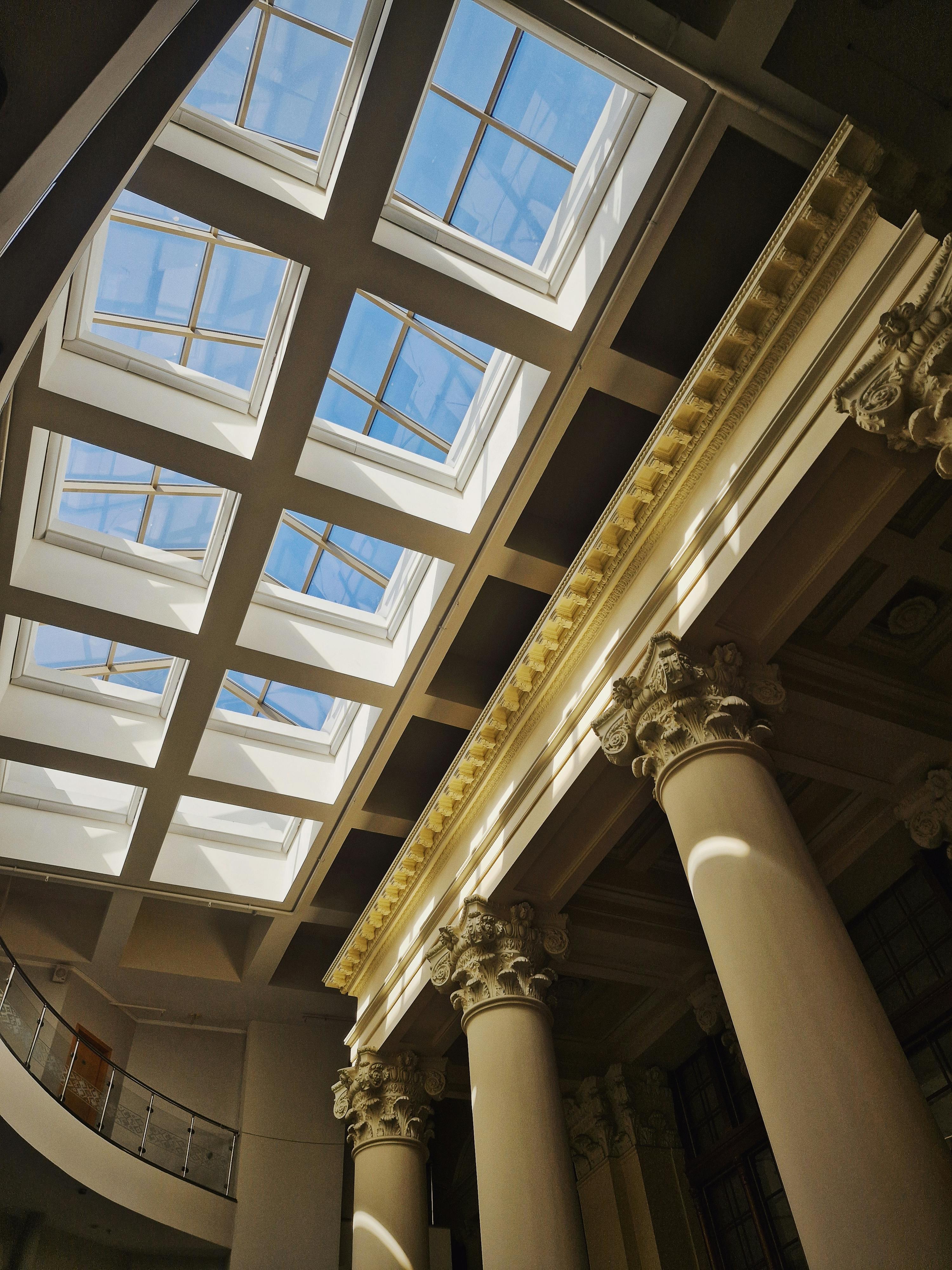 Elegant Interior with Skylight and Columns · Free Stock Photo