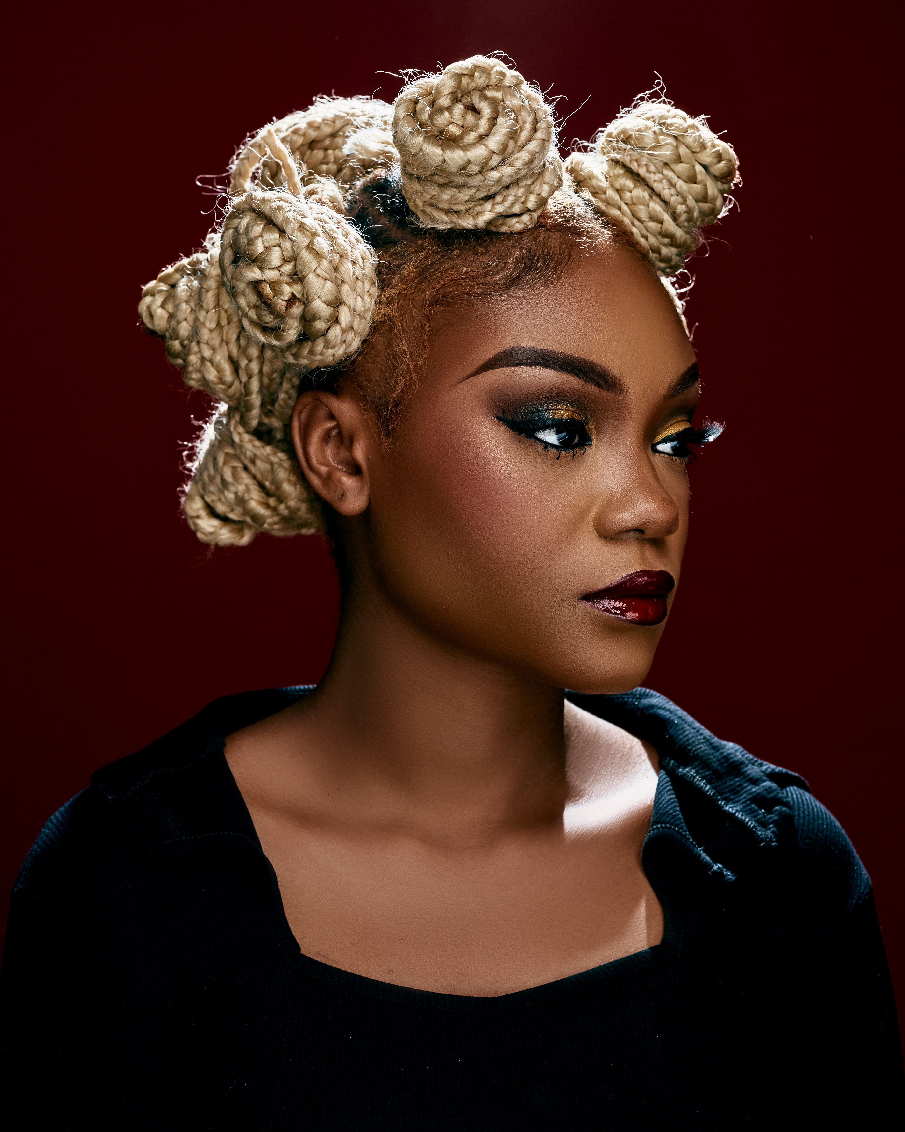 Elegant Portrait of Woman with Intricate Braids · Free Stock Photo