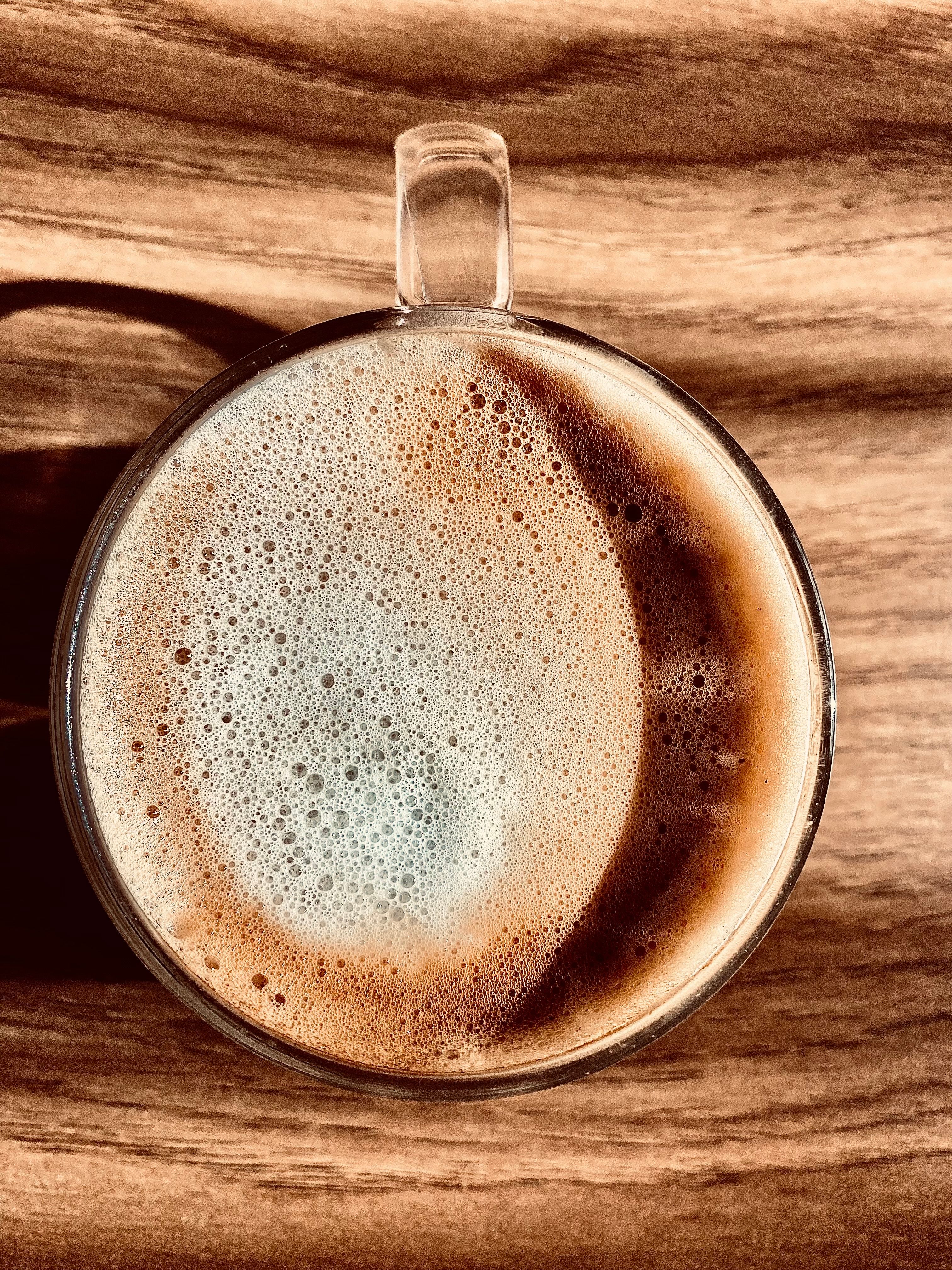 Aerial View of Frothy Coffee in Sunlight · Free Stock Photo