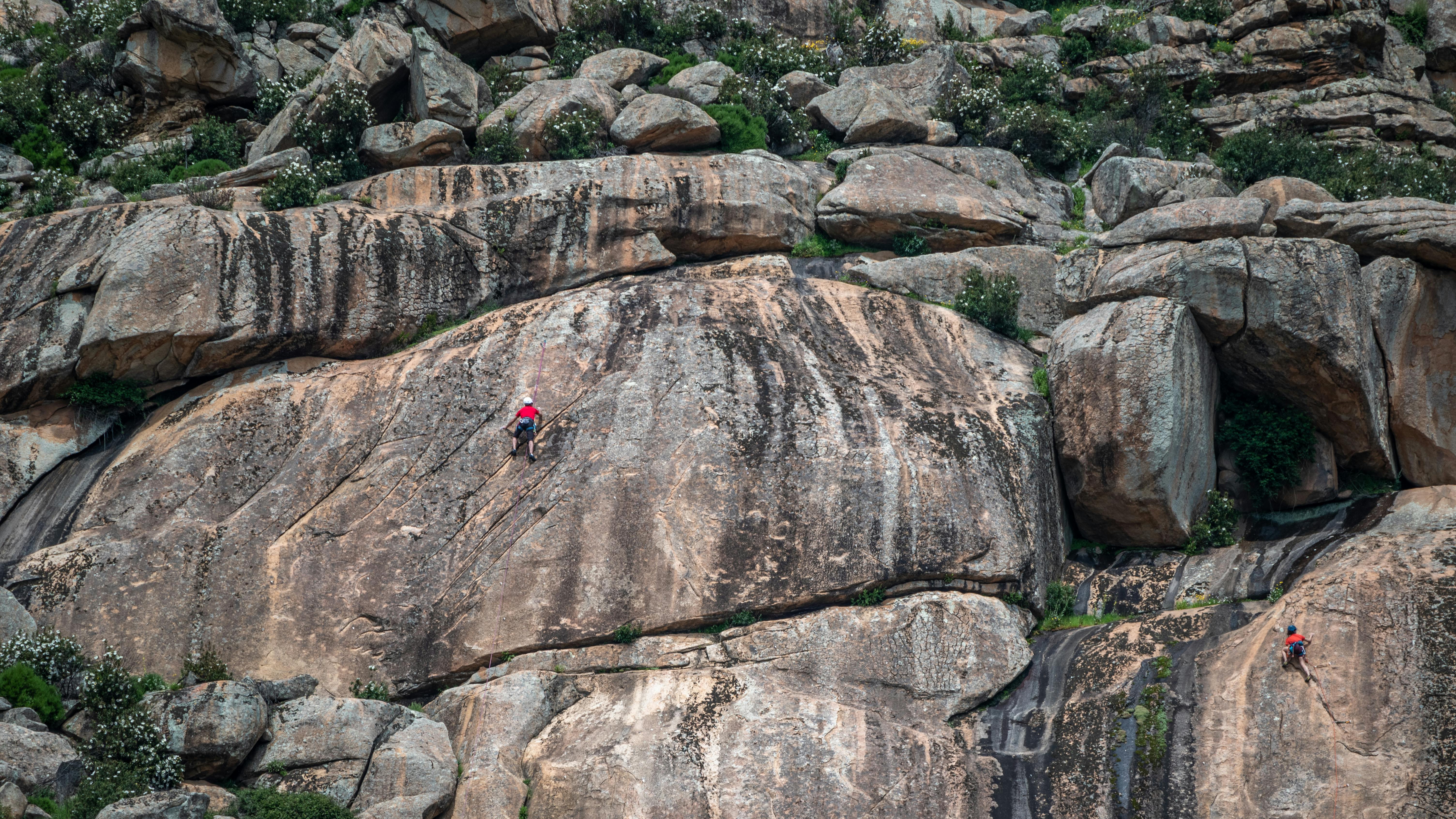 Rock Climbers Scaling Manzanares el Real Cliff · Free Stock Photo