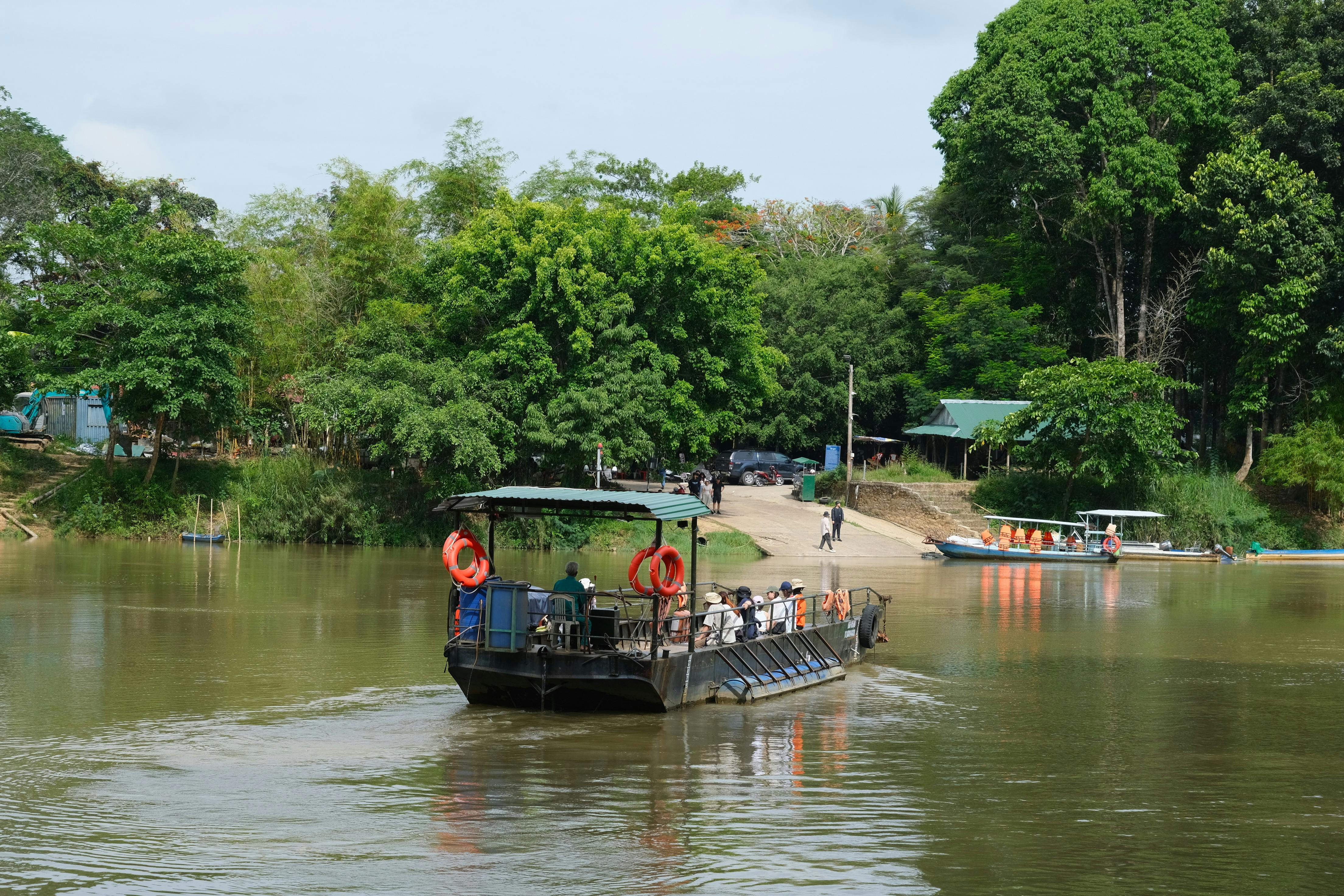 Scenic River Ferry Crossing with Passengers · Free Stock Photo