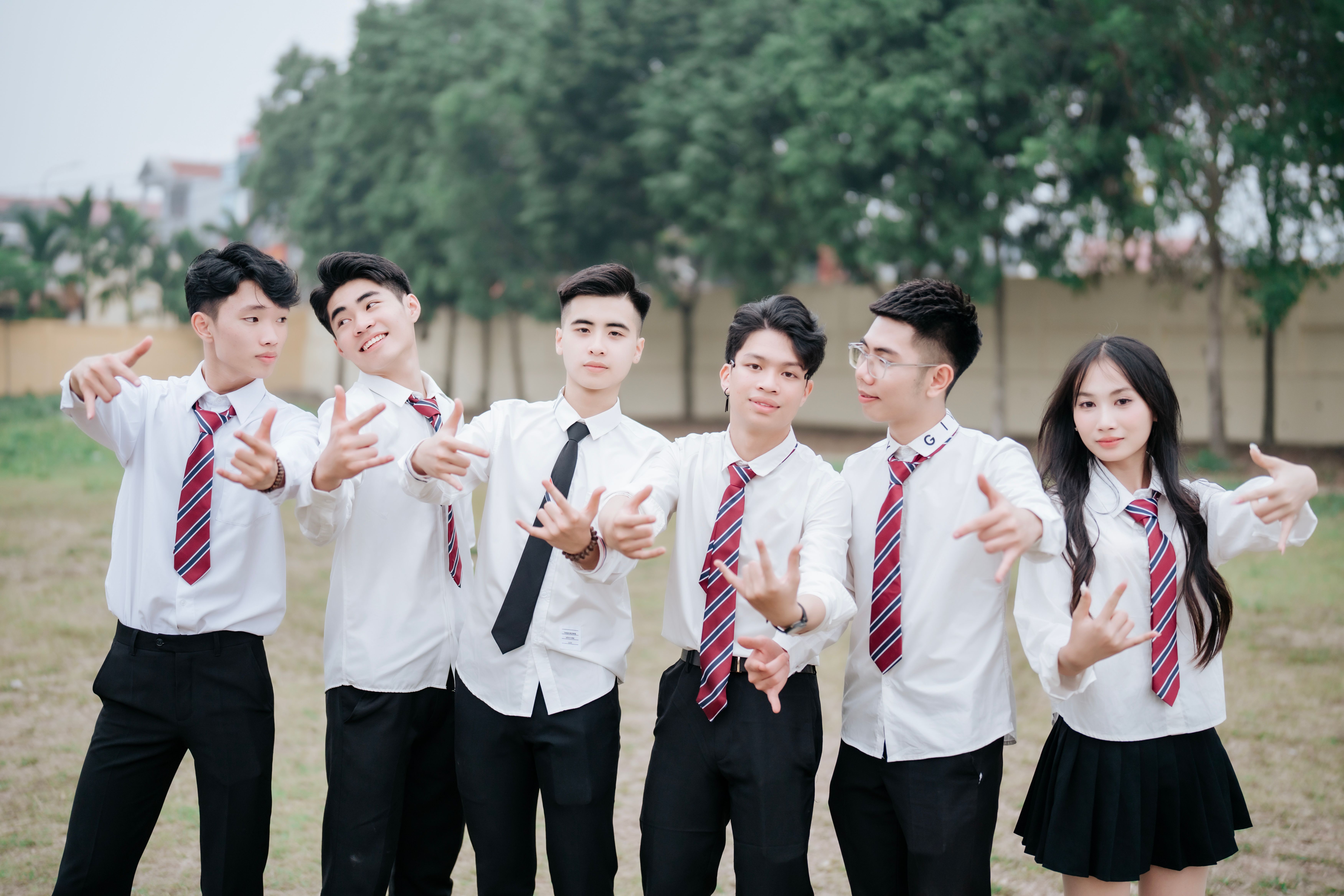 Group of Students in Uniforms Outdoors · Free Stock Photo