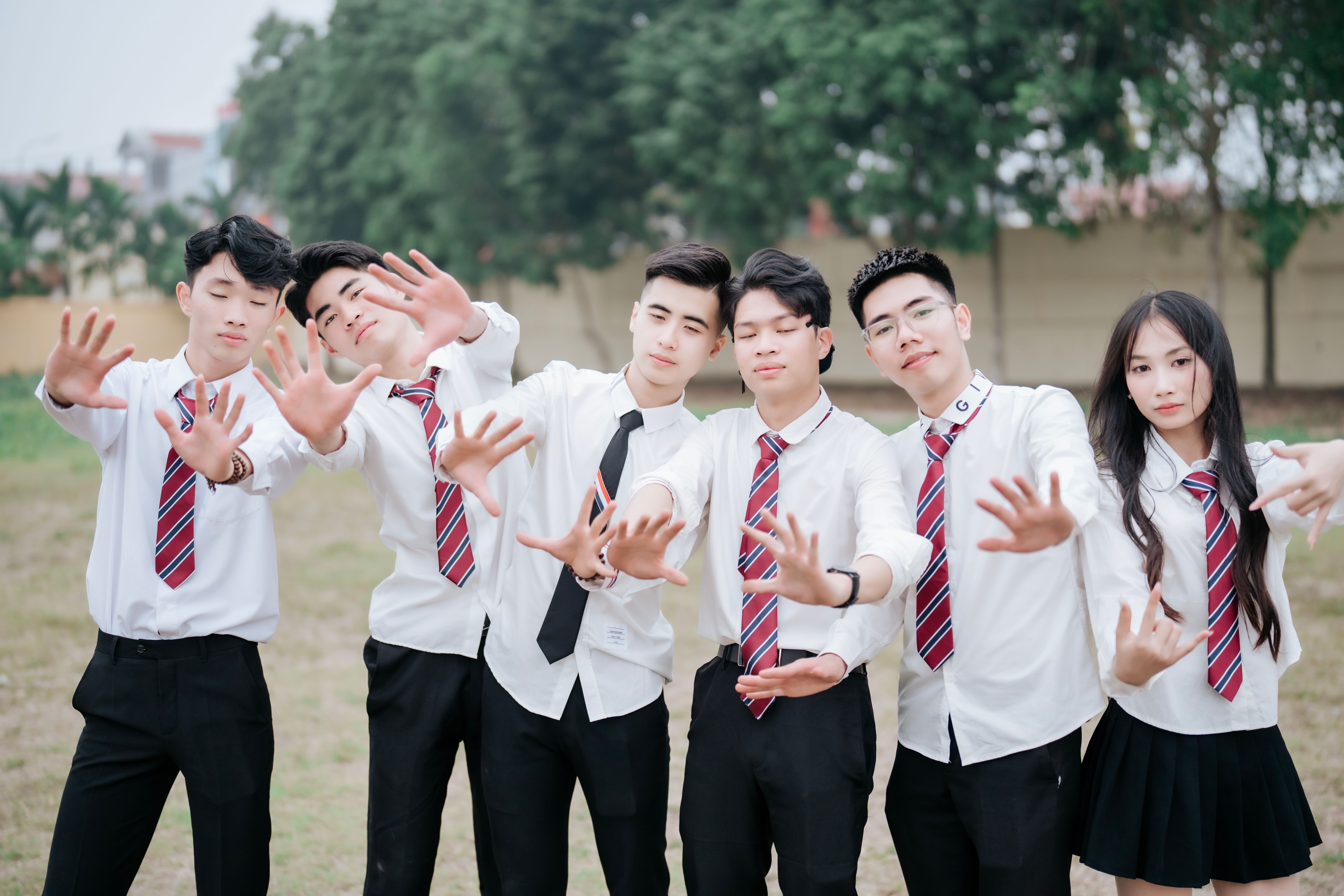 Group of Teens in School Uniforms Outdoors · Free Stock Photo