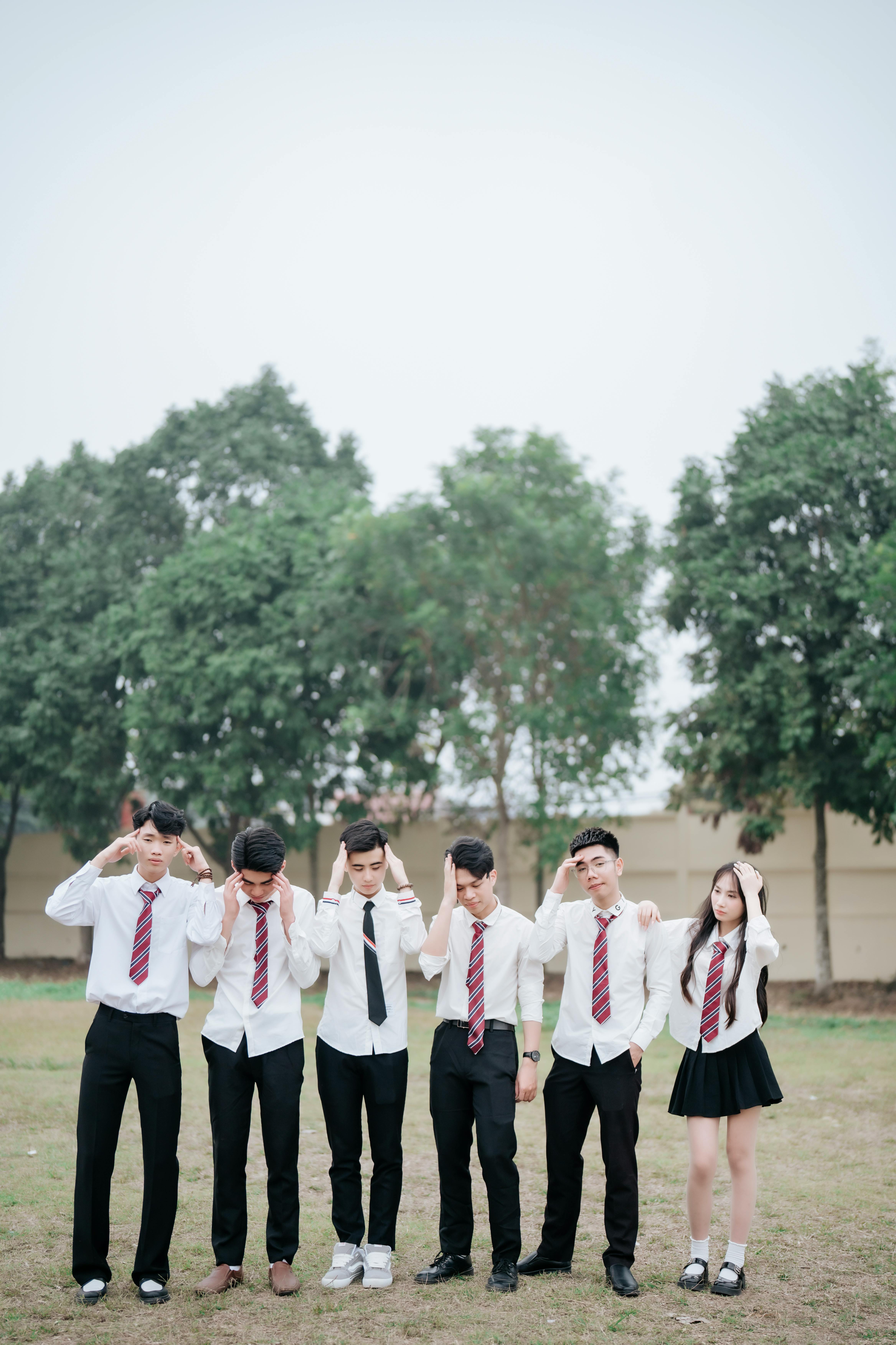Group of Students in Uniforms Outdoors · Free Stock Photo