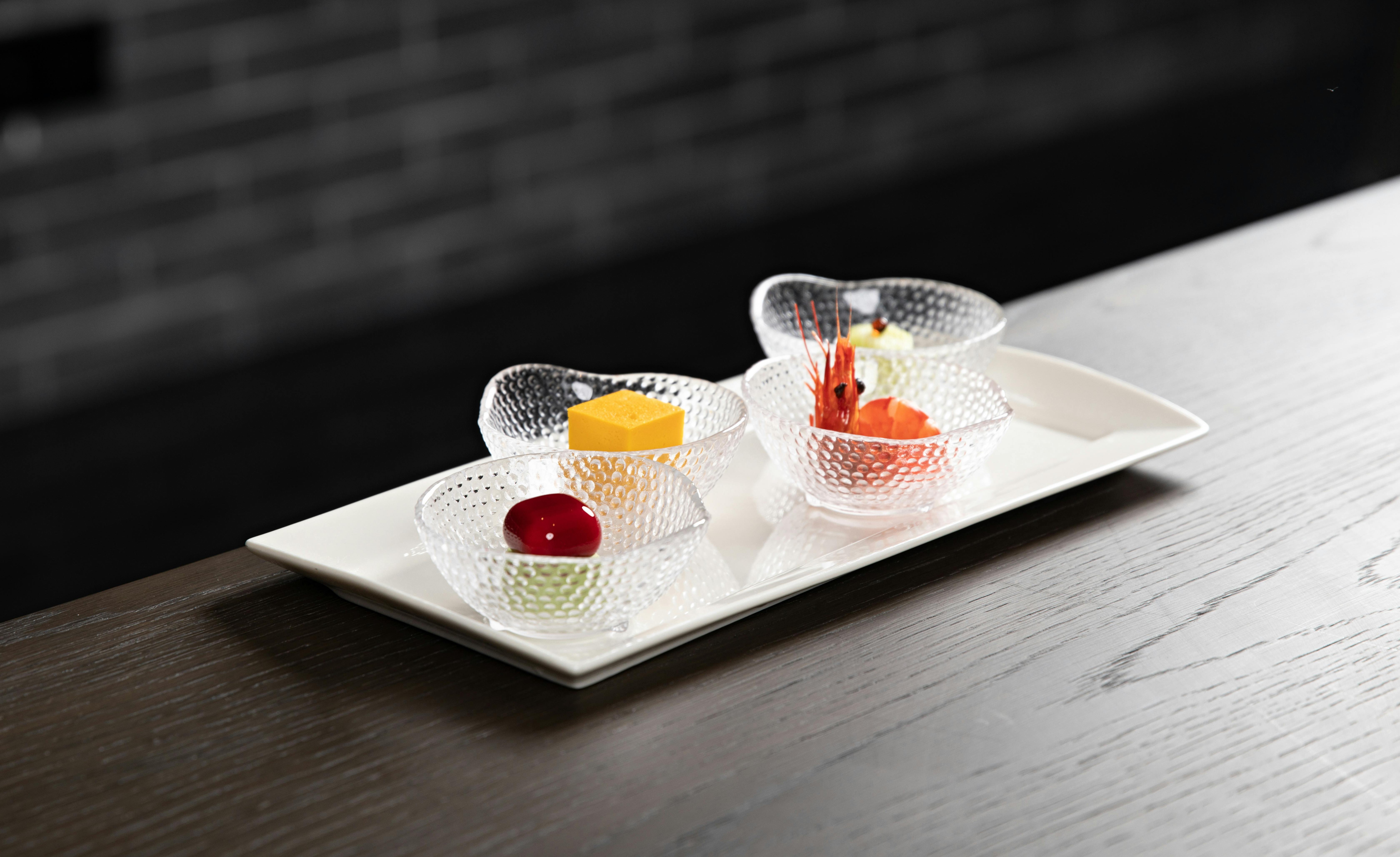 Elegant Modern Plated Appetizers on Display · Free Stock Photo