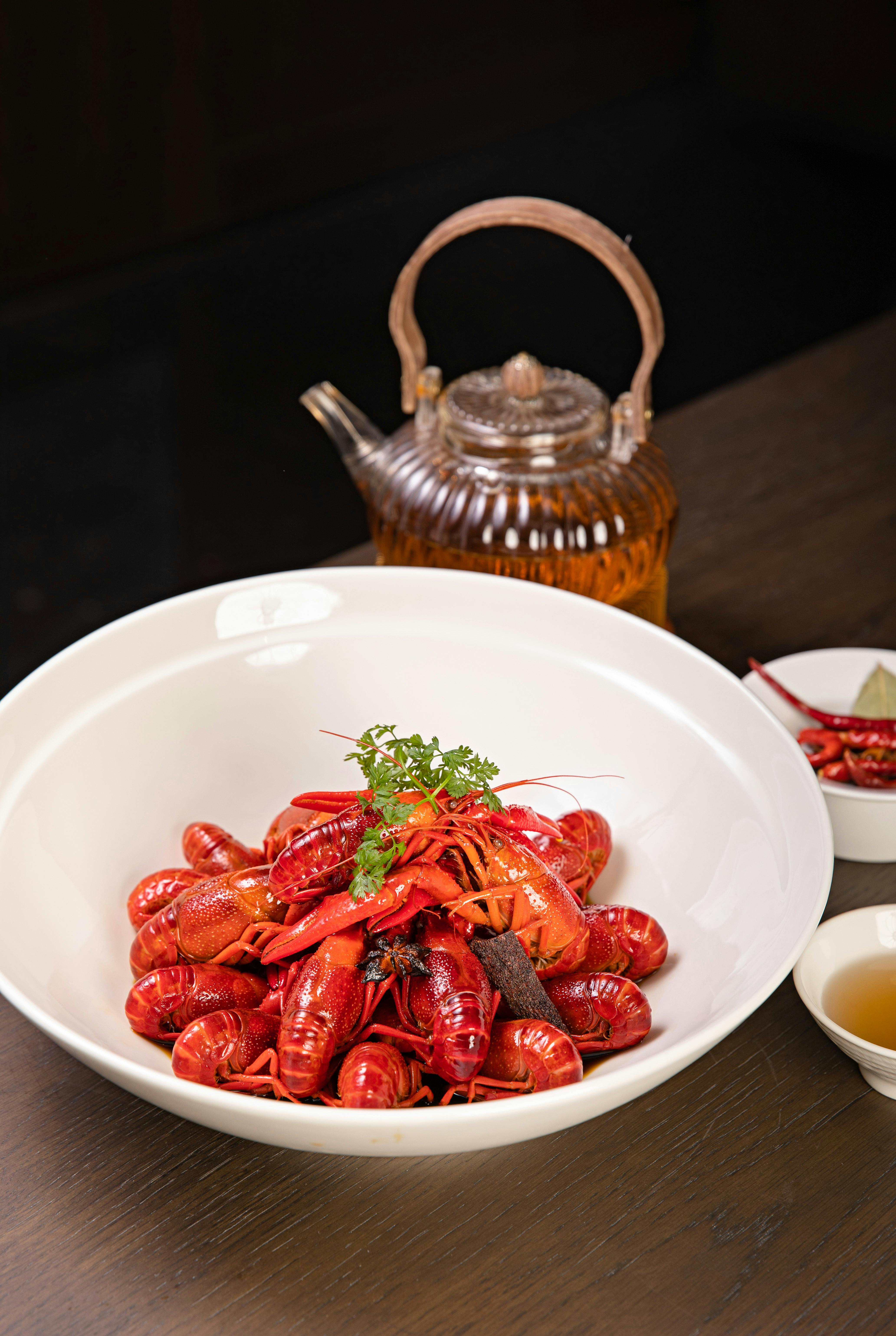 Delicious Cajun Style Crawfish Dish with Tea · Free Stock Photo