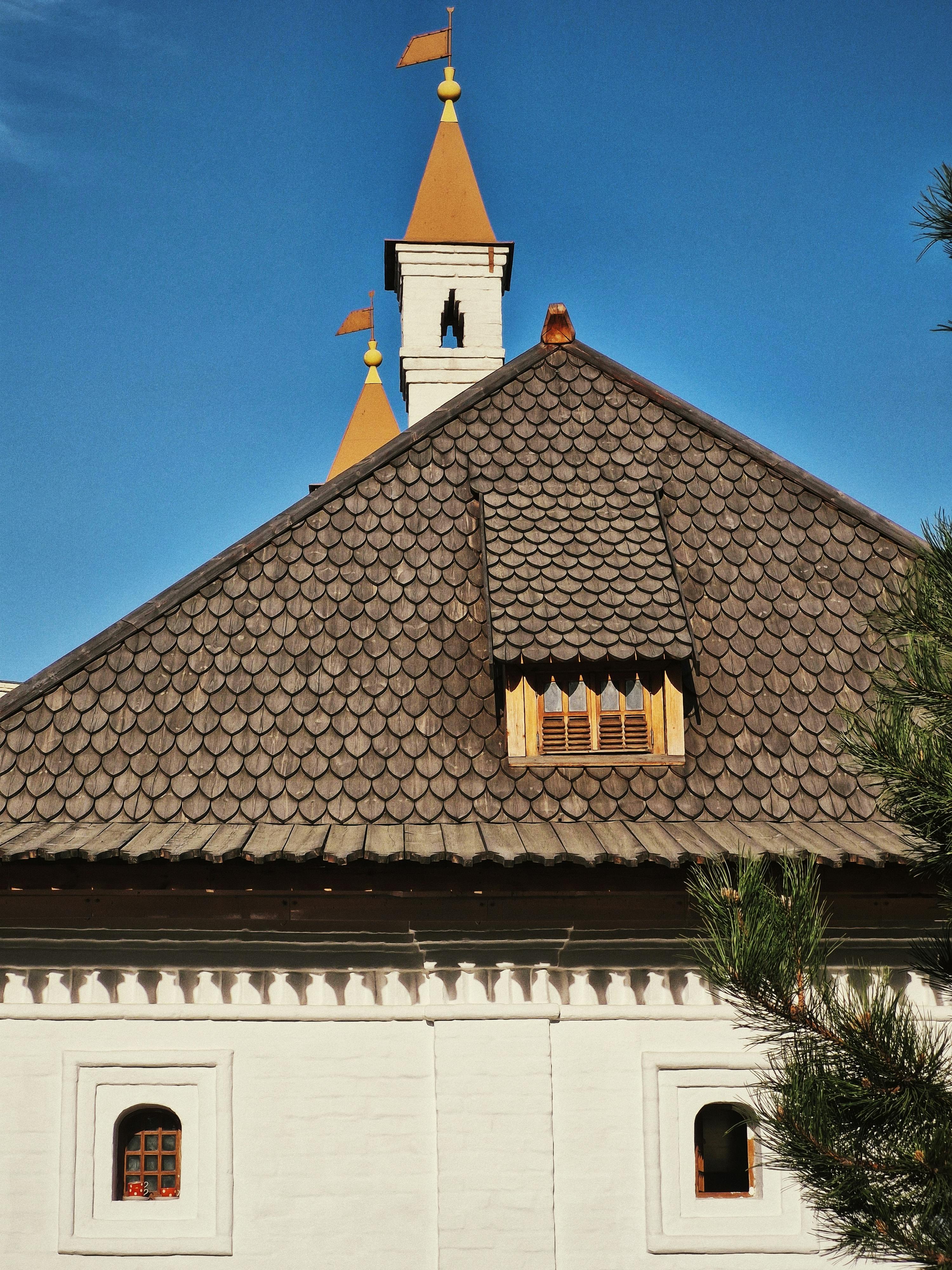 Historic Architectural Roof with Blue Sky · Free Stock Photo