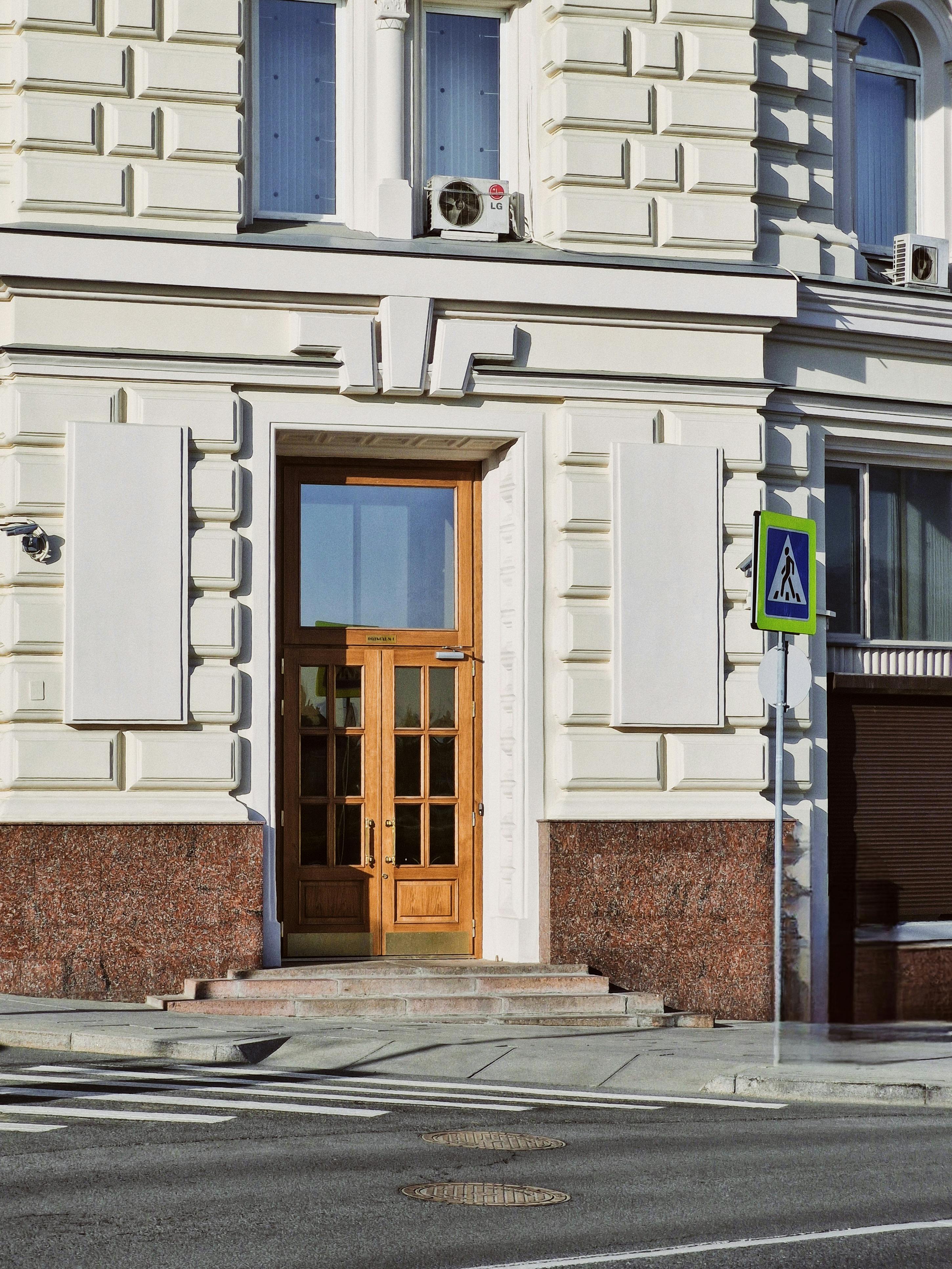 Elegant Urban Building Facade with Doorway · Free Stock Photo