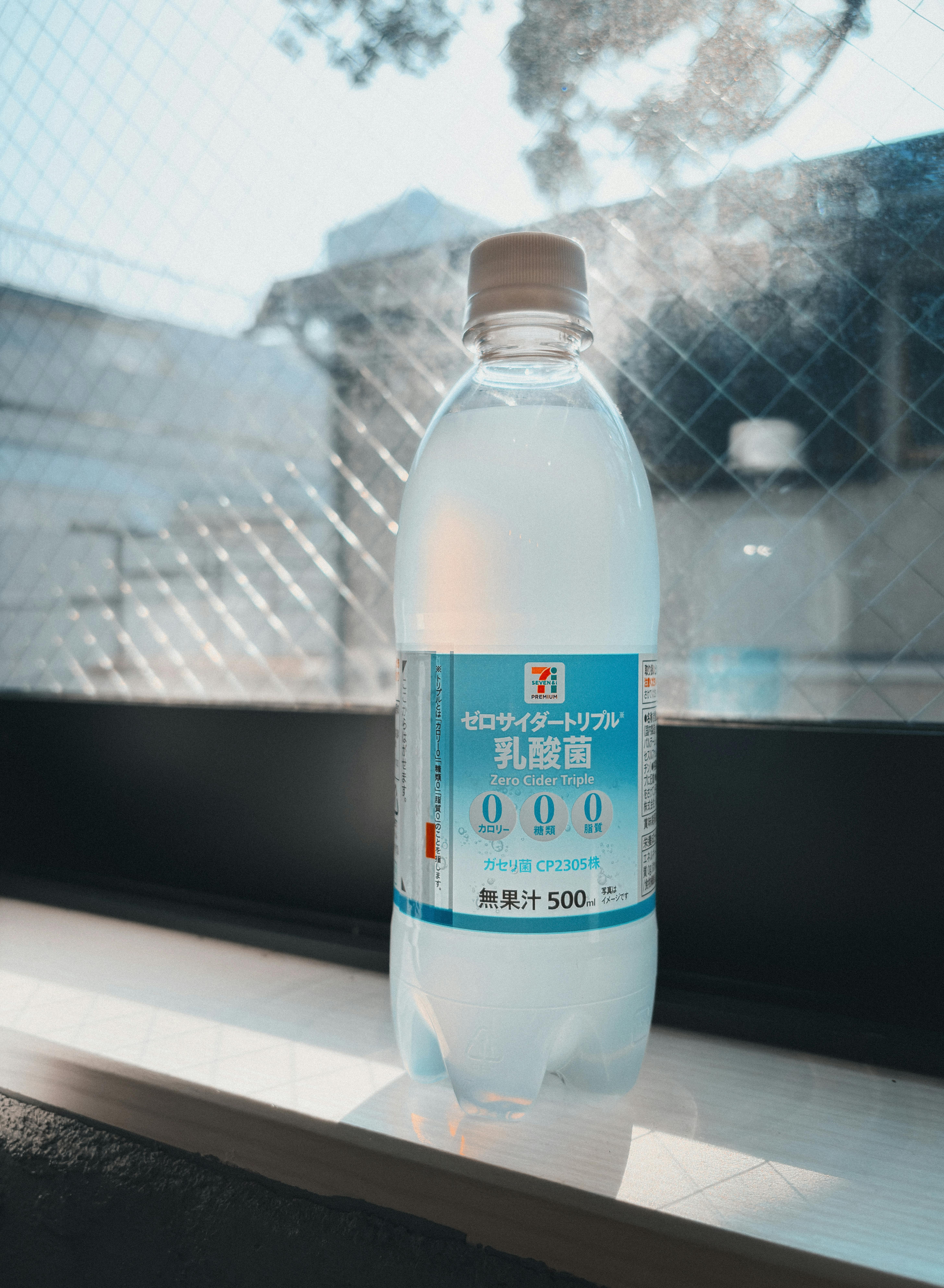 Chilled Bottle of Japanese Beverage by Window · Free Stock Photo