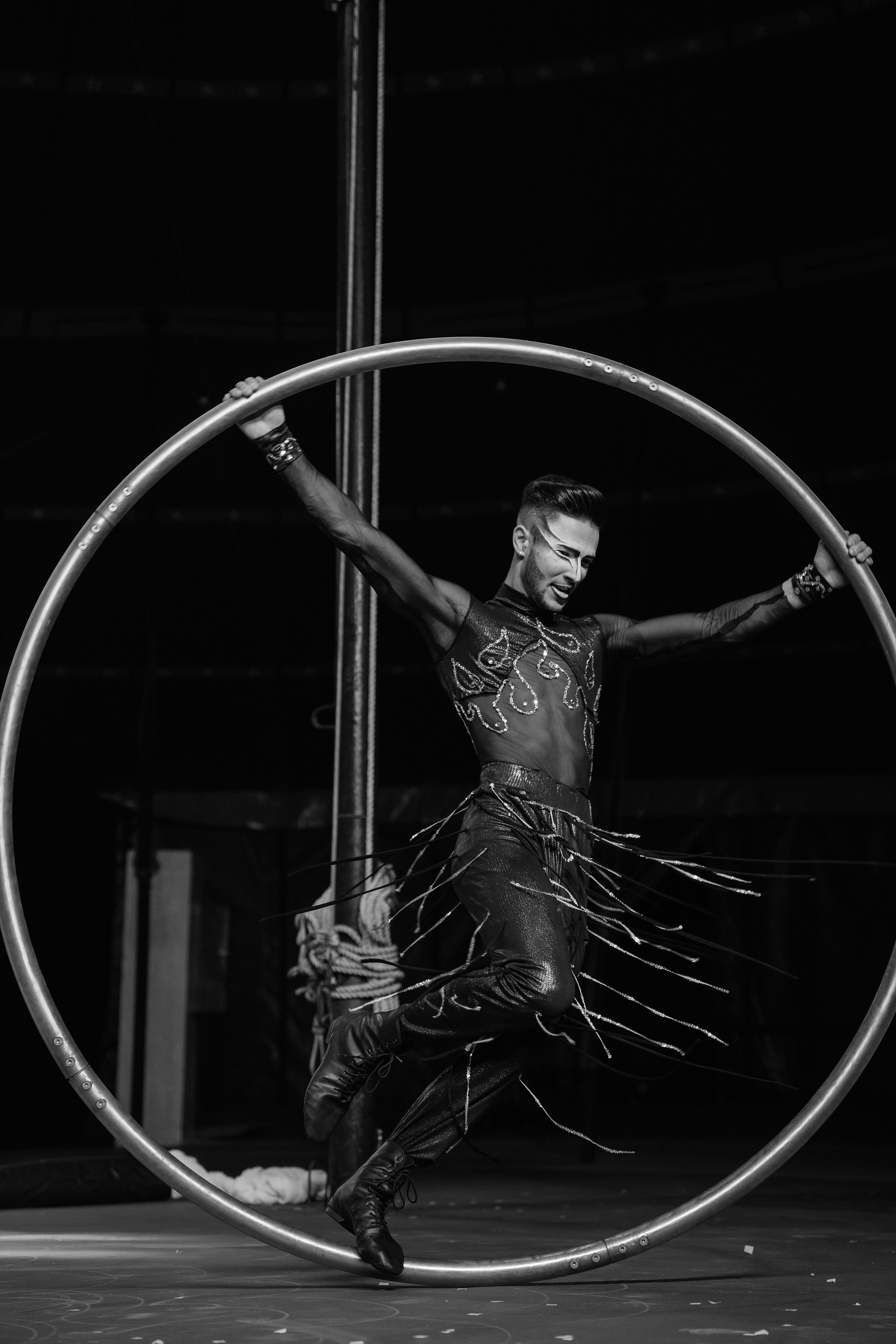 Acrobat Performing with Cyr Wheel in Circus · Free Stock Photo