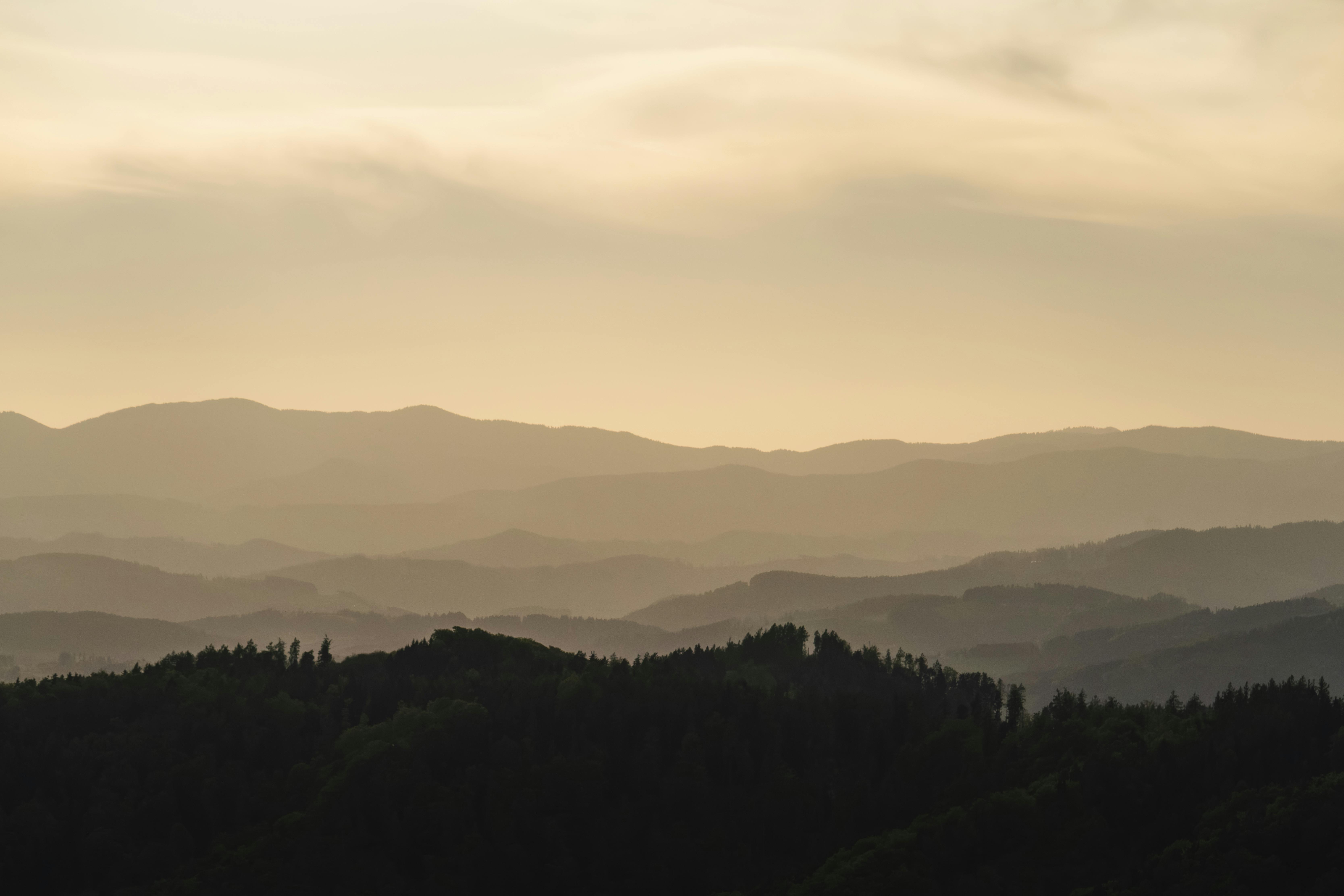 Peaceful Layered Mountain Landscape at Sunset · Free Stock Photo
