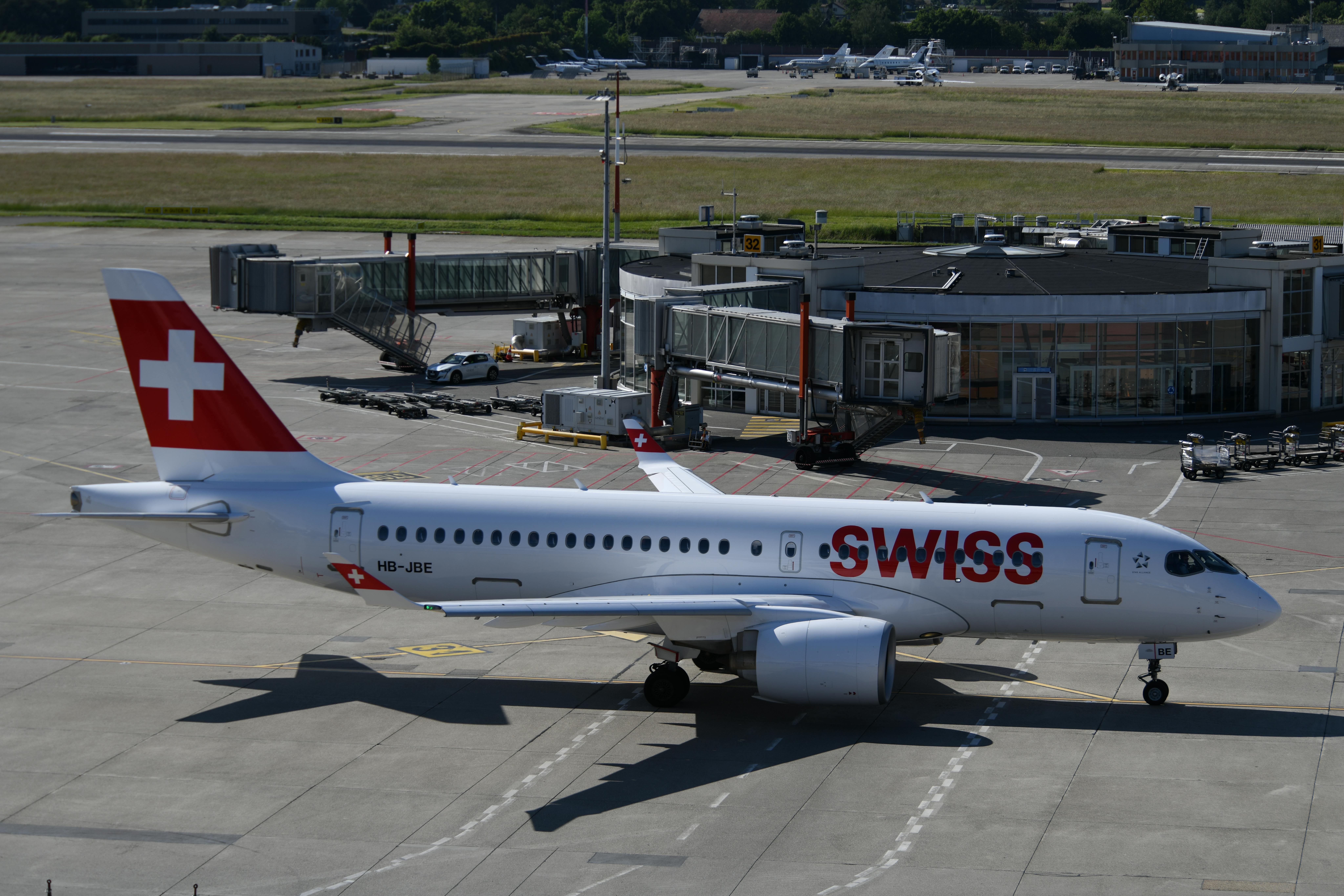 Swiss Airplane on Runway at Geneva Airport · Free Stock Photo