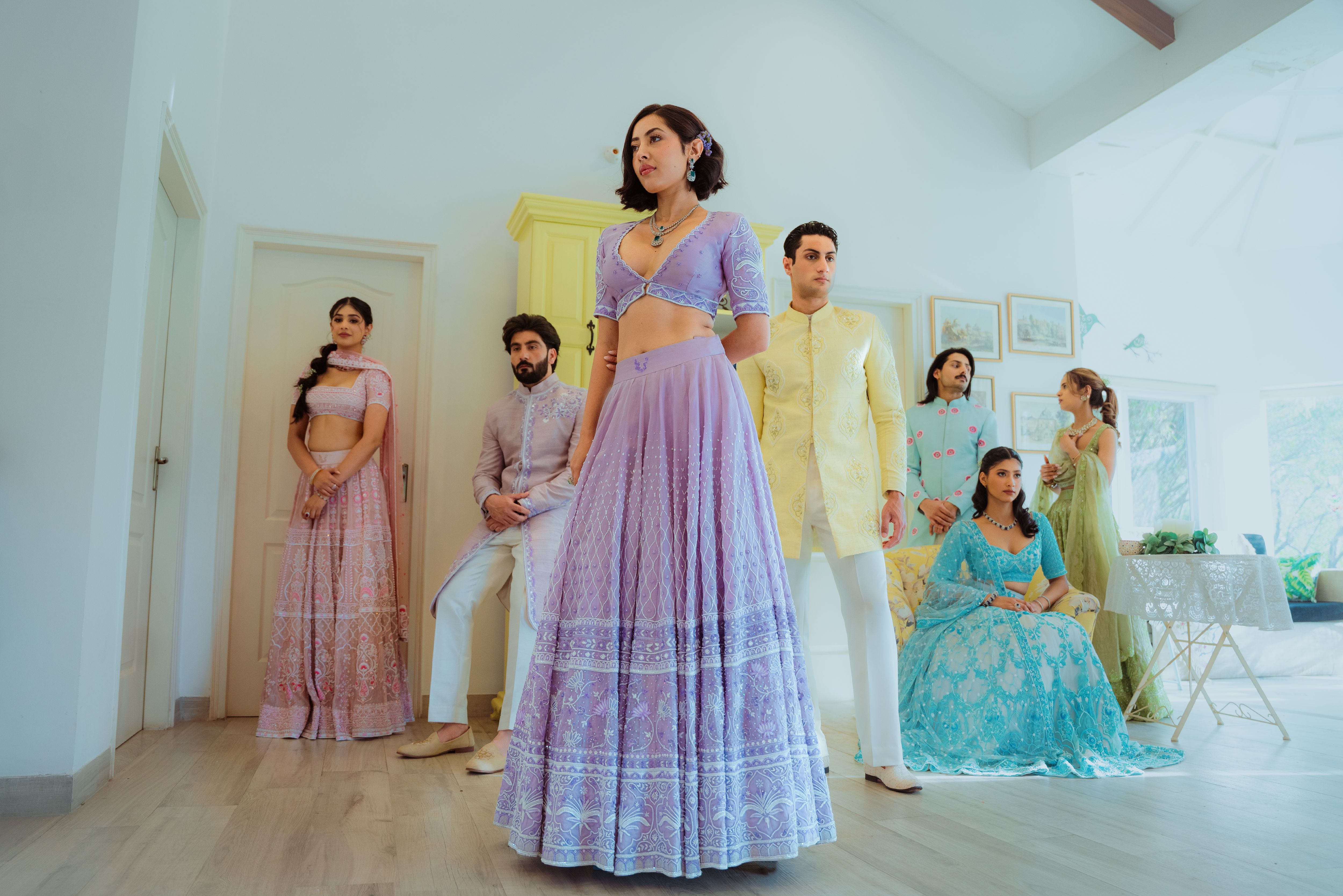 Elegant Group in Traditional Indian Attire Indoors · Free Stock Photo