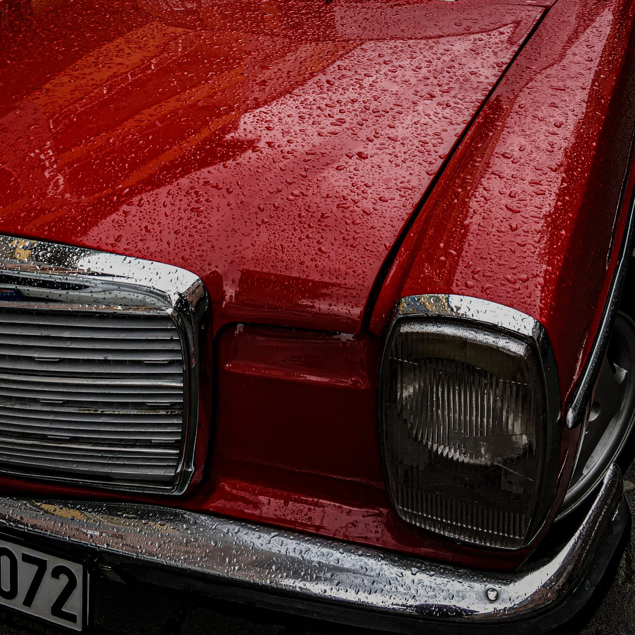 Close-up of Classic Red Car with Raindrops · Free Stock Photo