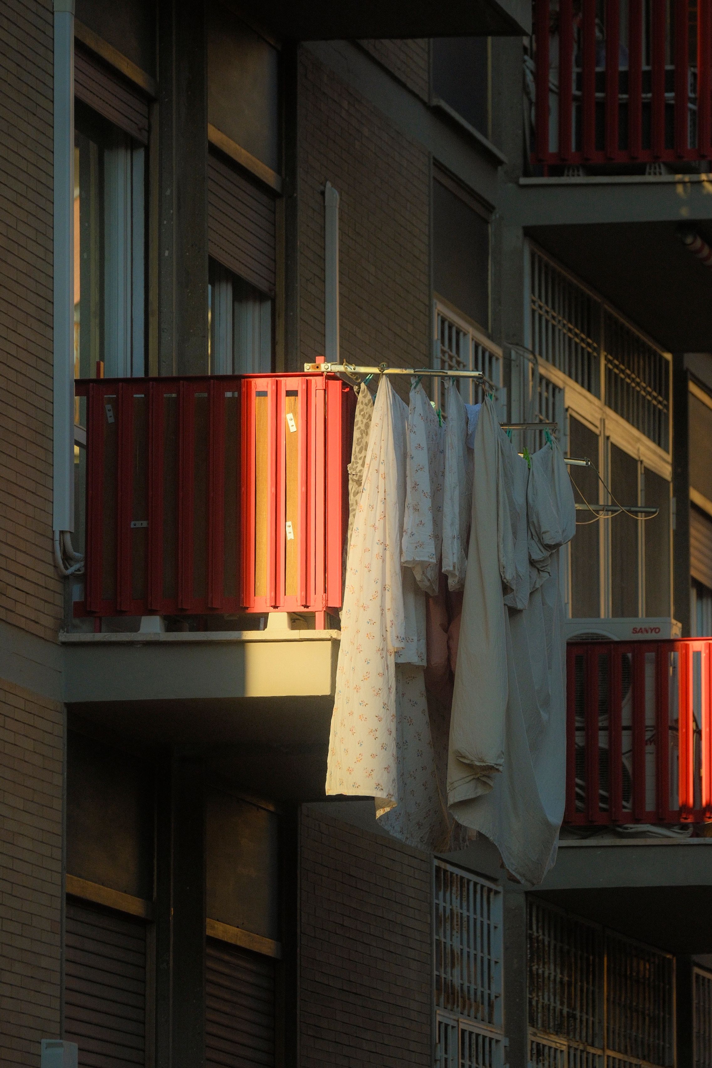 Laundry Hanging on Balcony at Sunset · Free Stock Photo