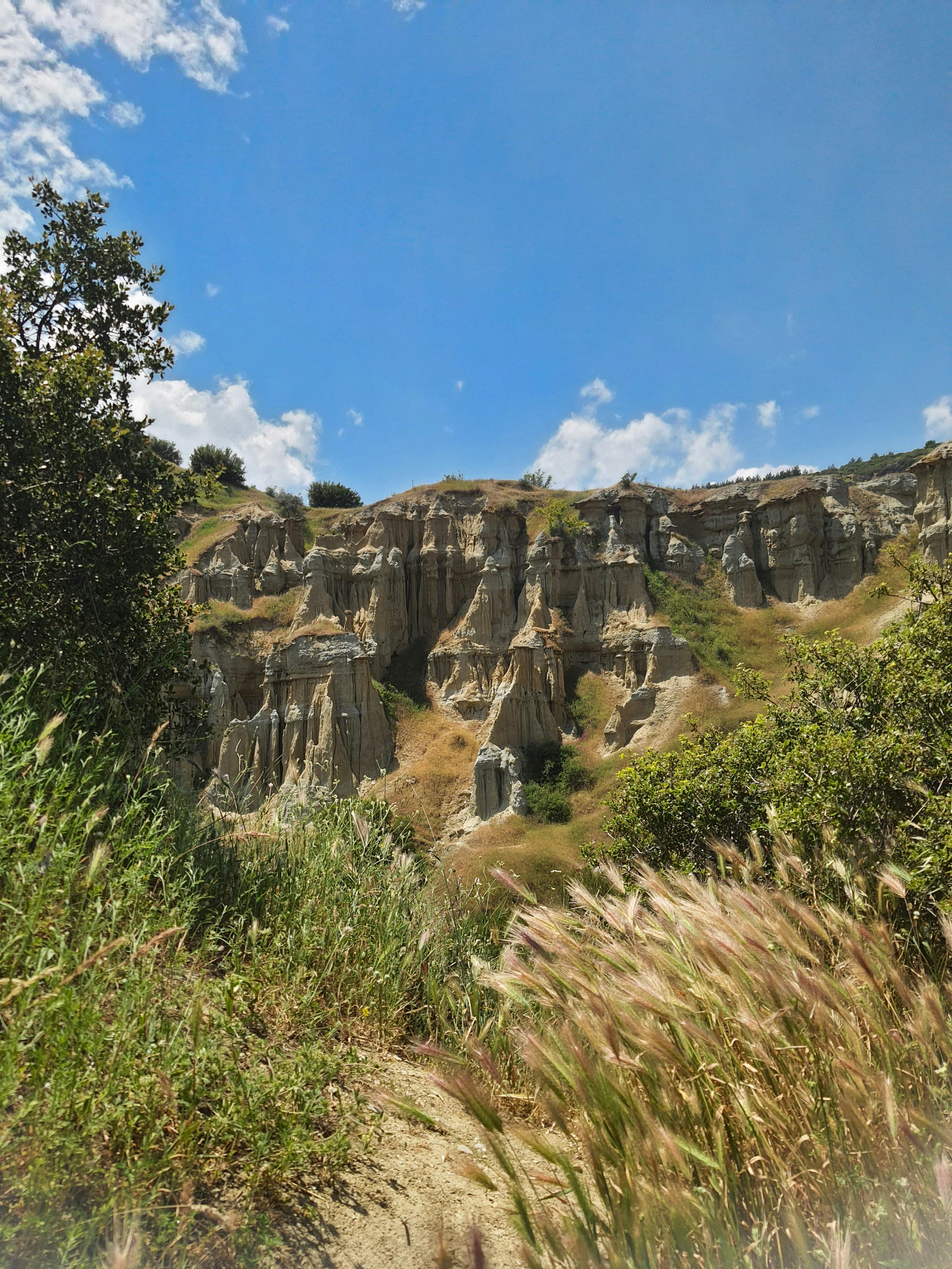 Dramatic Rocky Landscape Under Blue Sky · Free Stock Photo