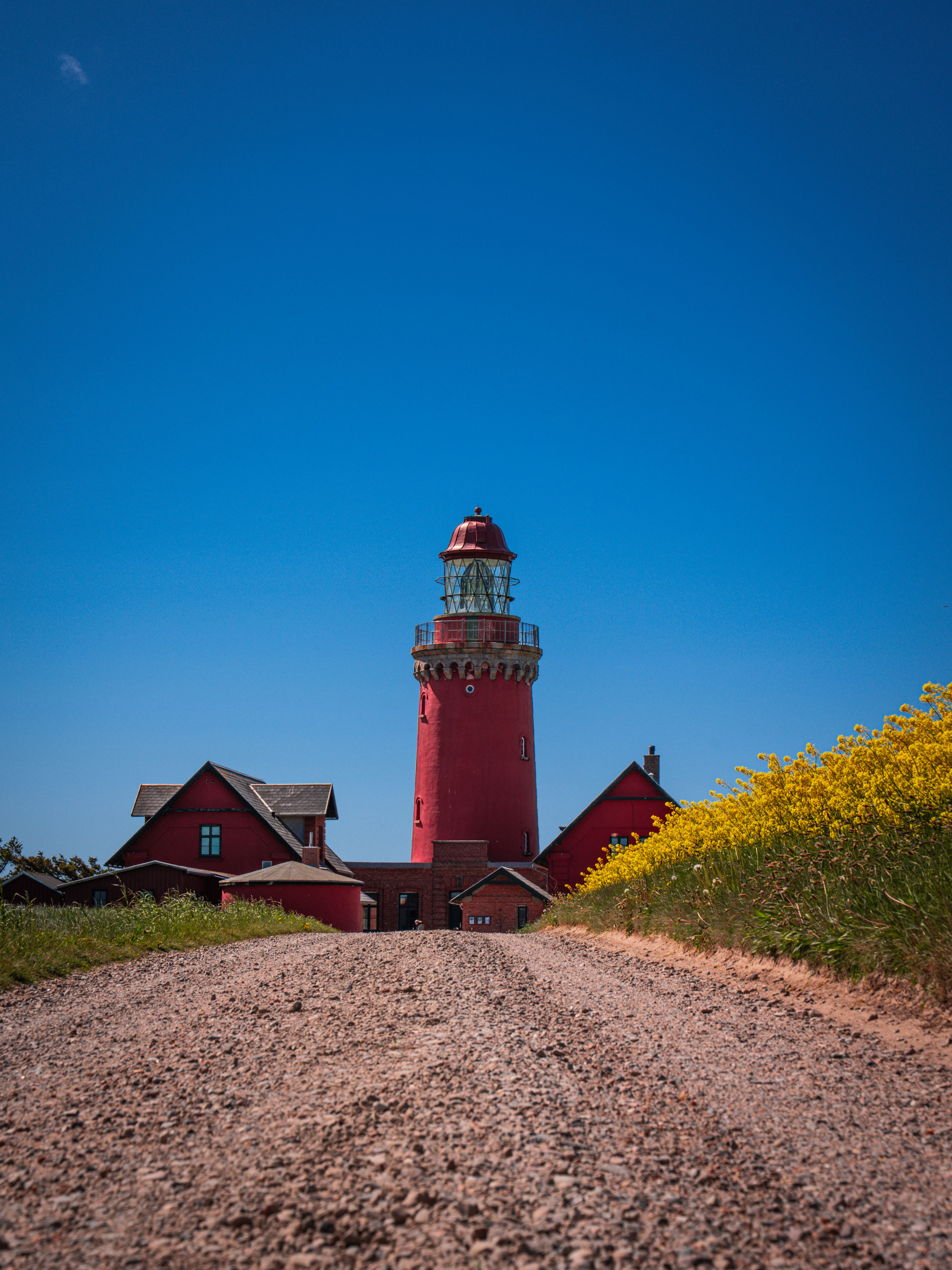 Vibrant Lighthouse in Denmark with Blue Sky · Free Stock Photo