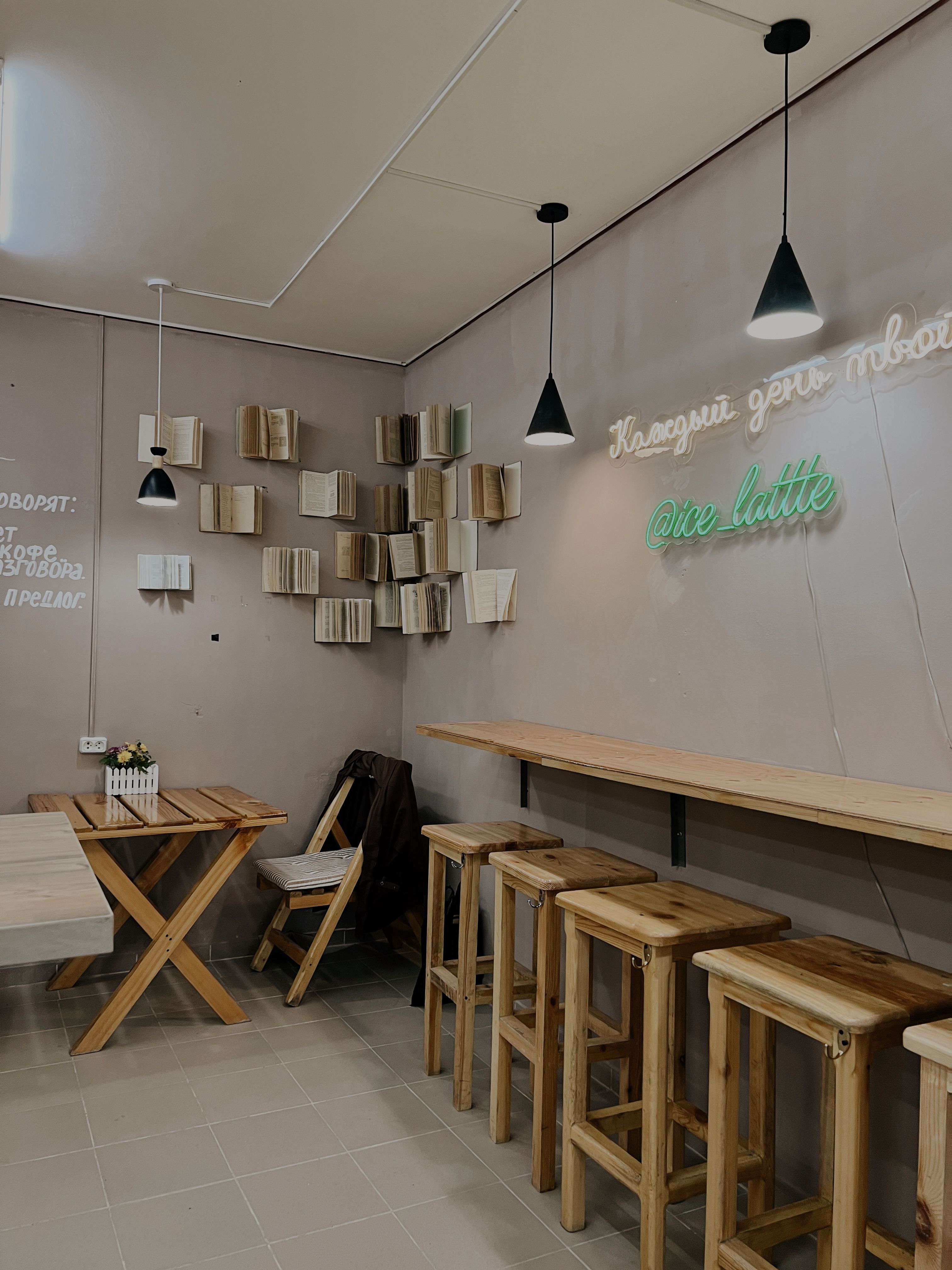 Cozy Cafe Interior with Wooden Furniture and Neon Signs · Free Stock Photo