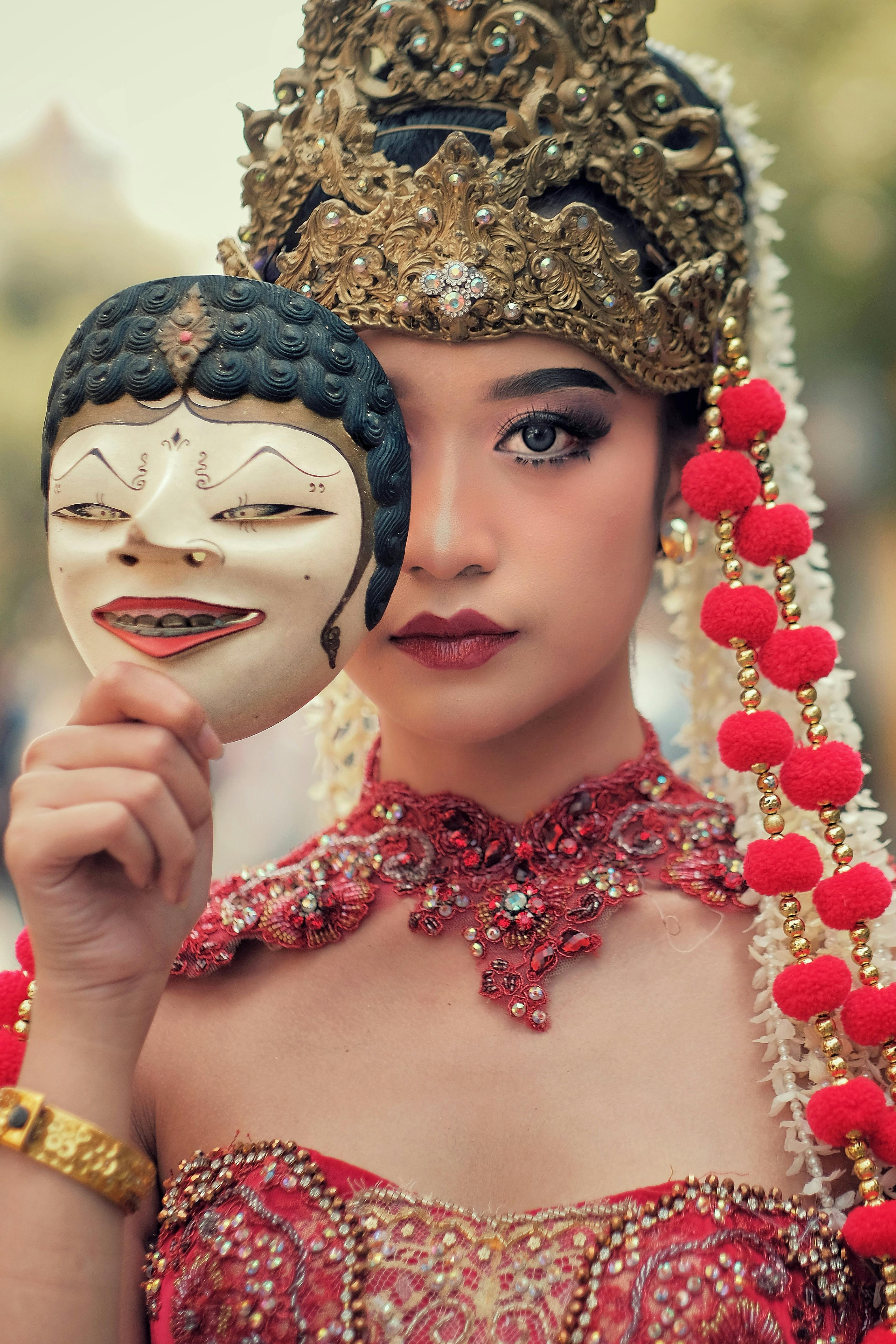 Traditional Balinese Dancer Holding Mask · Free Stock Photo