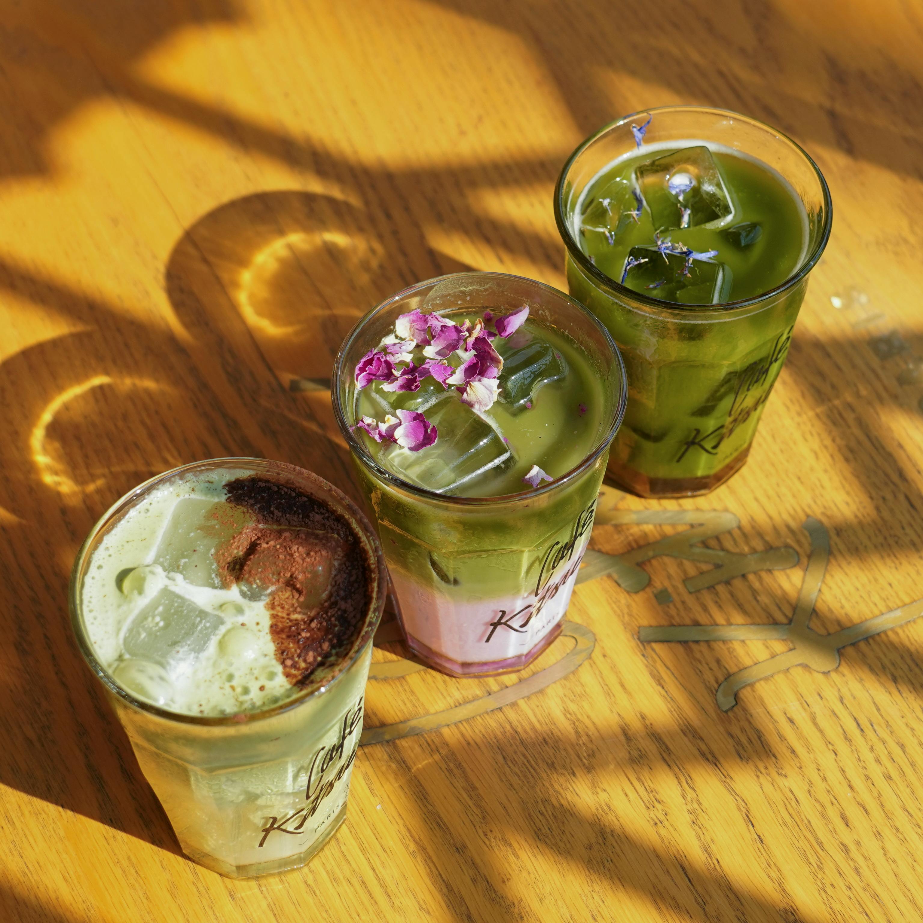 Refreshing Iced Matcha Lattes with Floral Garnish · Free Stock Photo