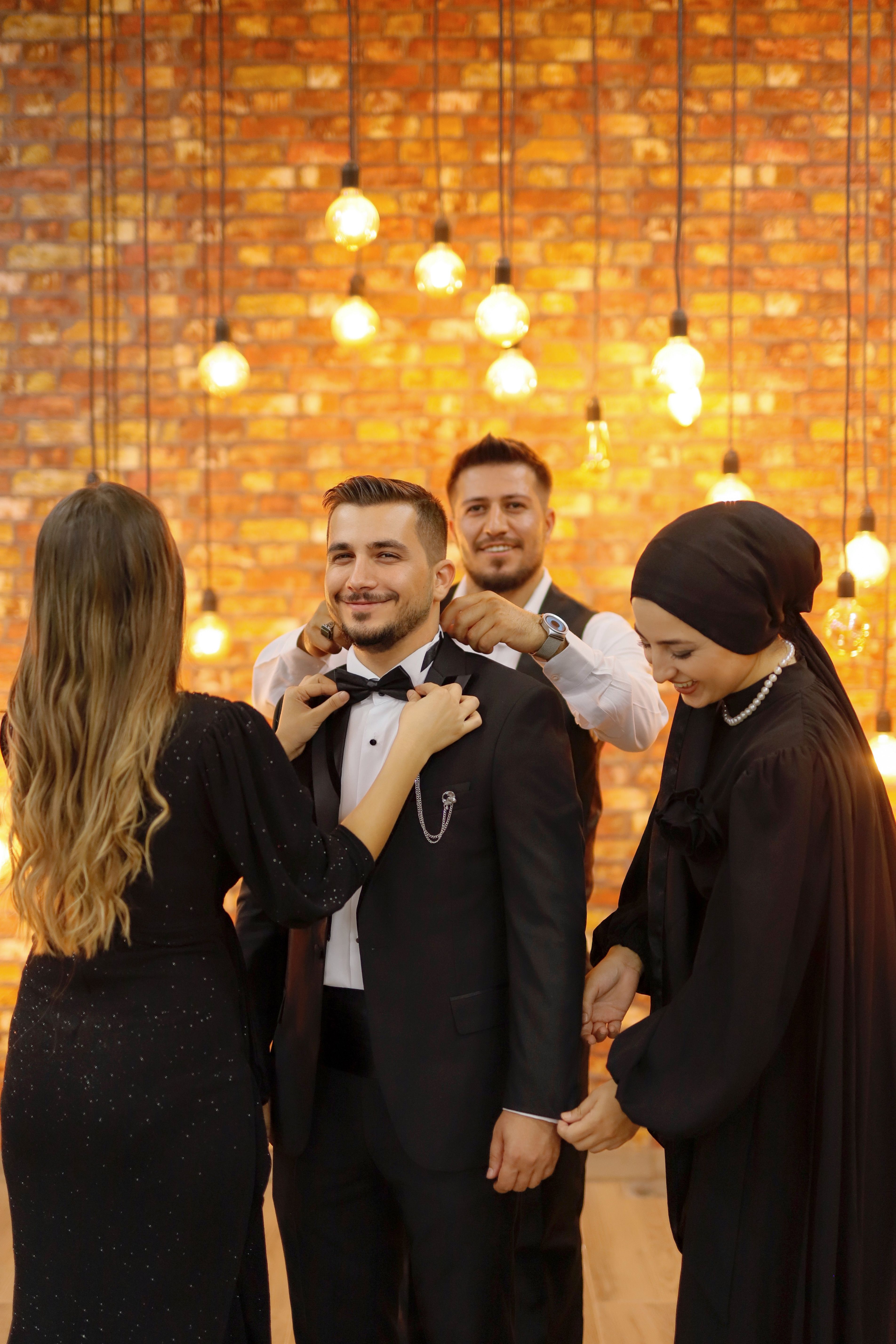 Elegant Group Preparing for a Formal Event · Free Stock Photo
