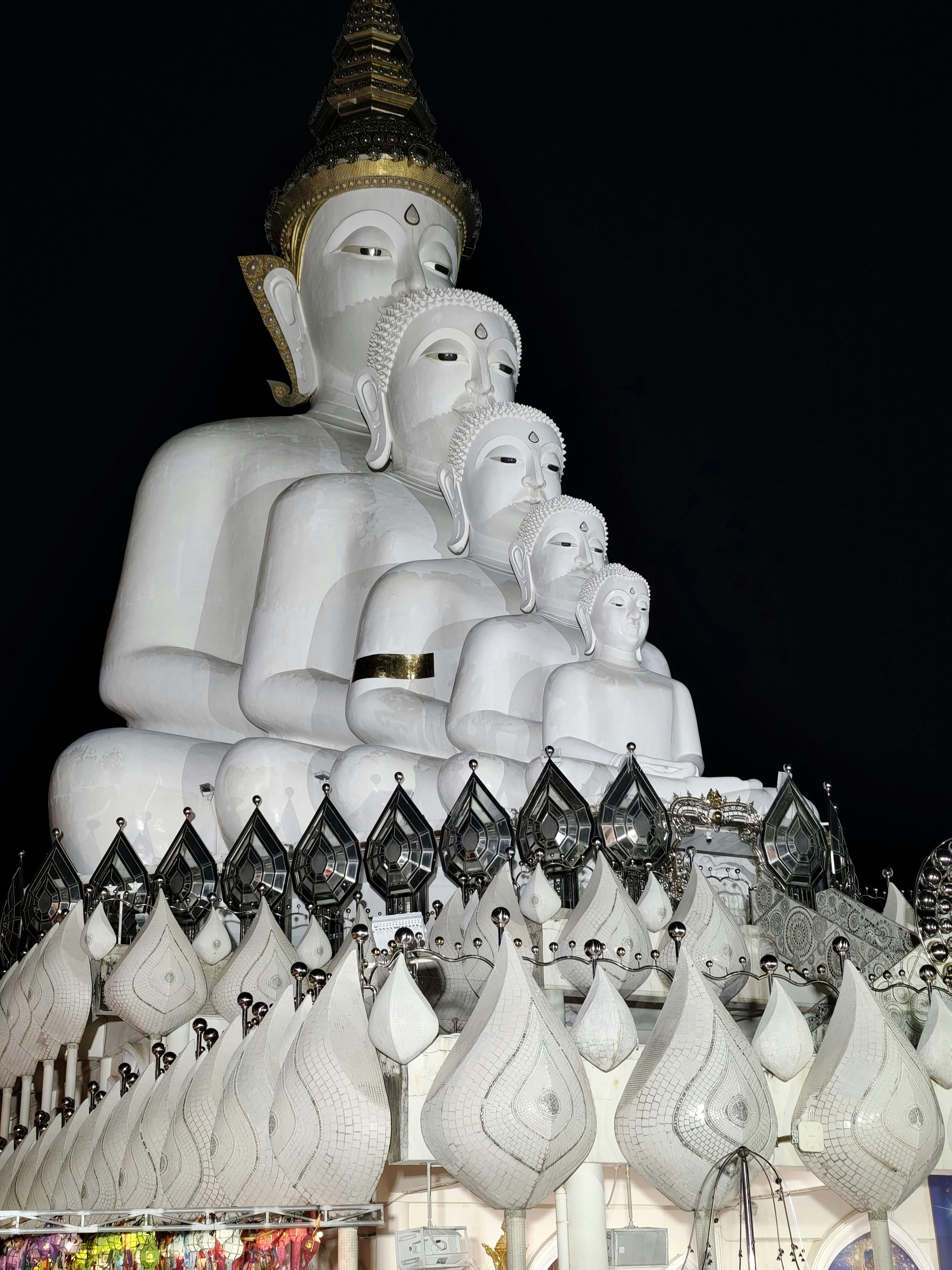 Five Intertwined Buddha Statues at Night · Free Stock Photo