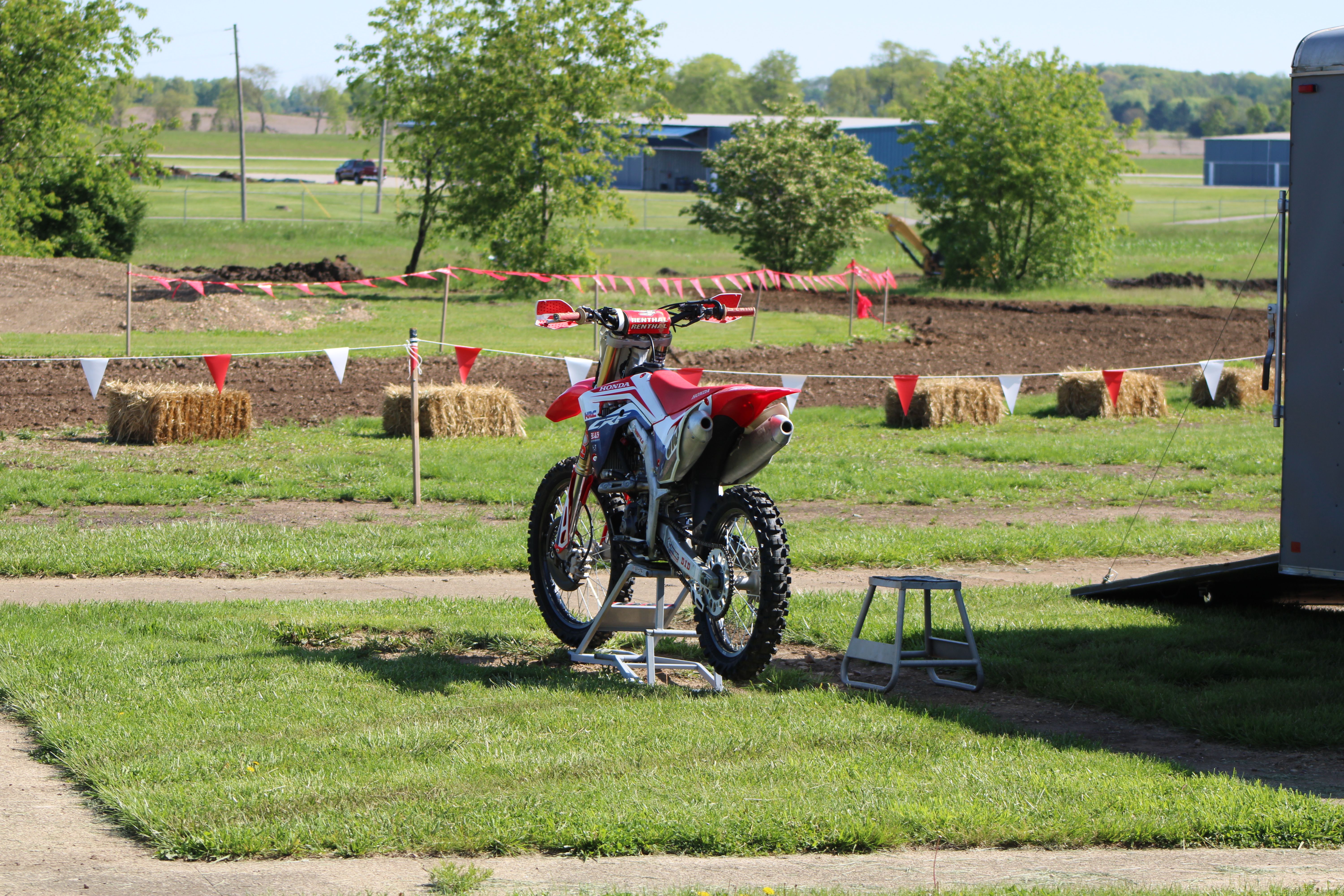 Red Dirt Bike Prepared for Motocross Race · Free Stock Photo