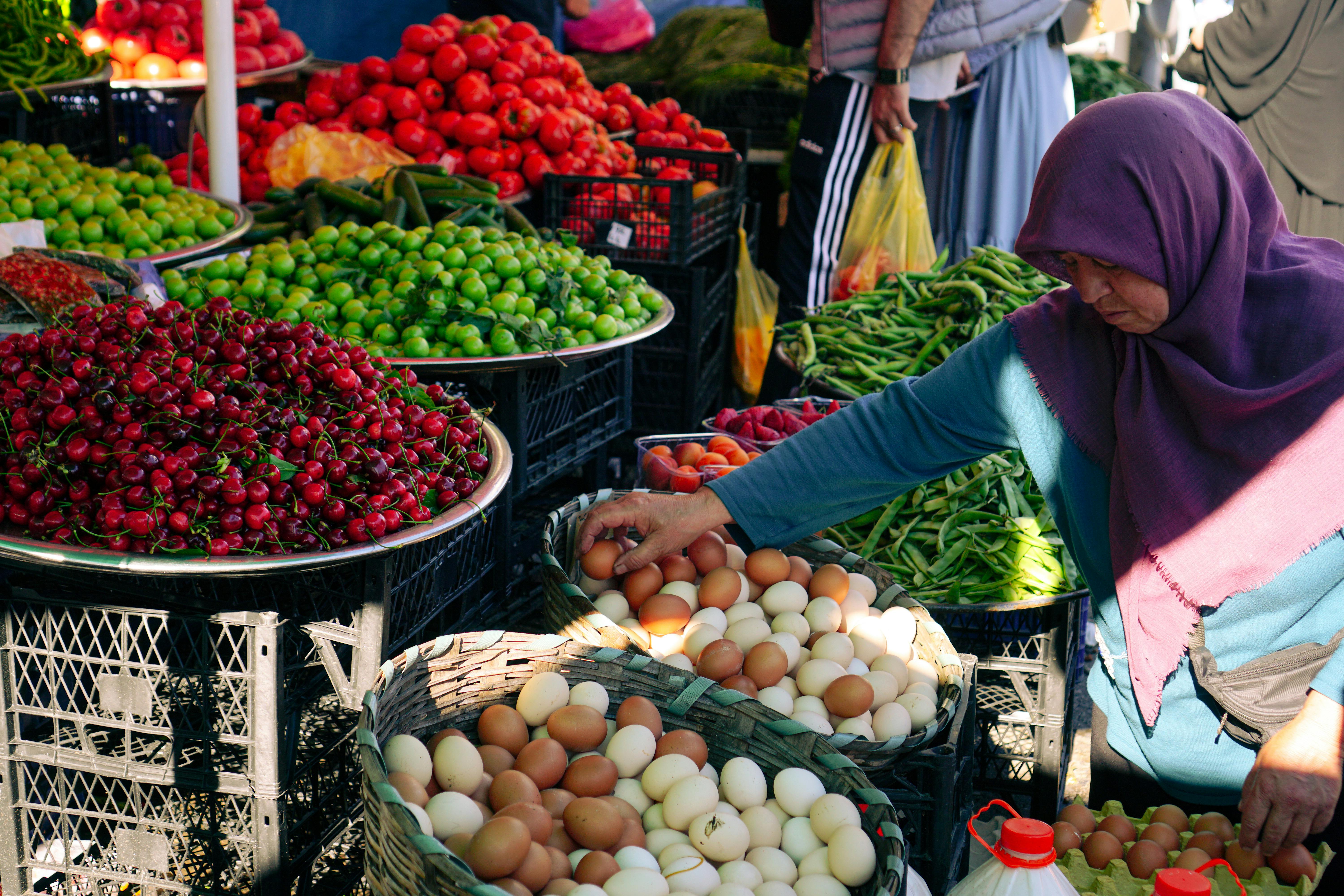 Vibrant Local Market Scene with Vegetables and Eggs · Free Stock Photo
