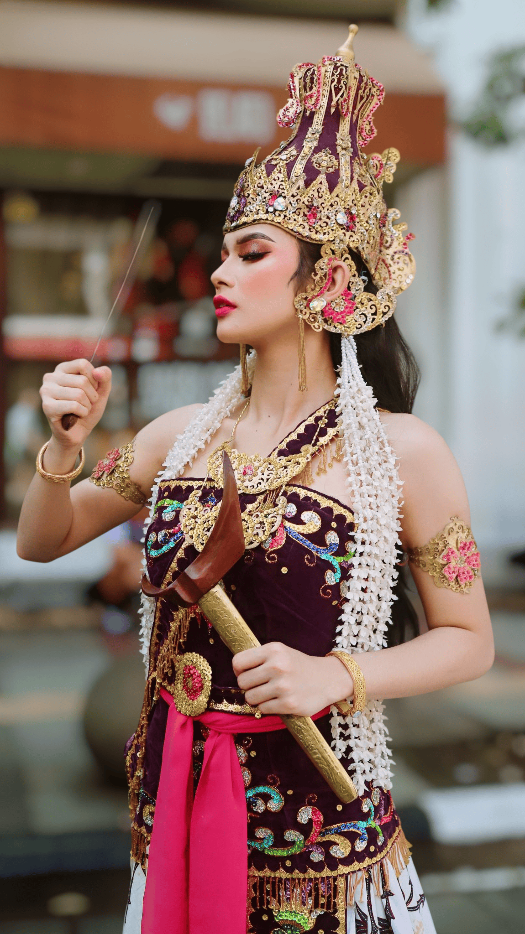 Traditional Balinese Wedding Attire in Scenic Landscape · Free Stock Photo