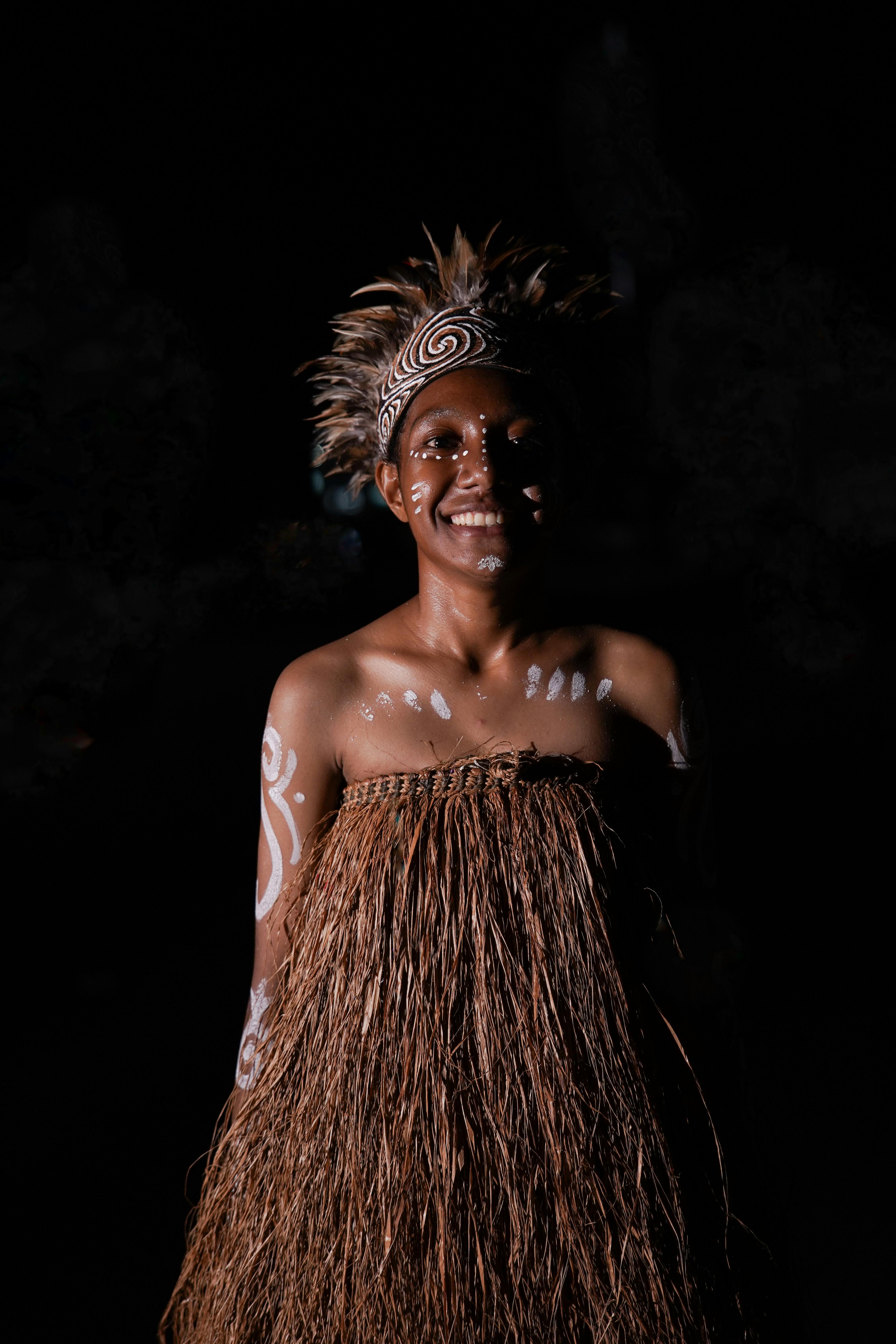 Smiling Person in Traditional Tribal Attire · Free Stock Photo