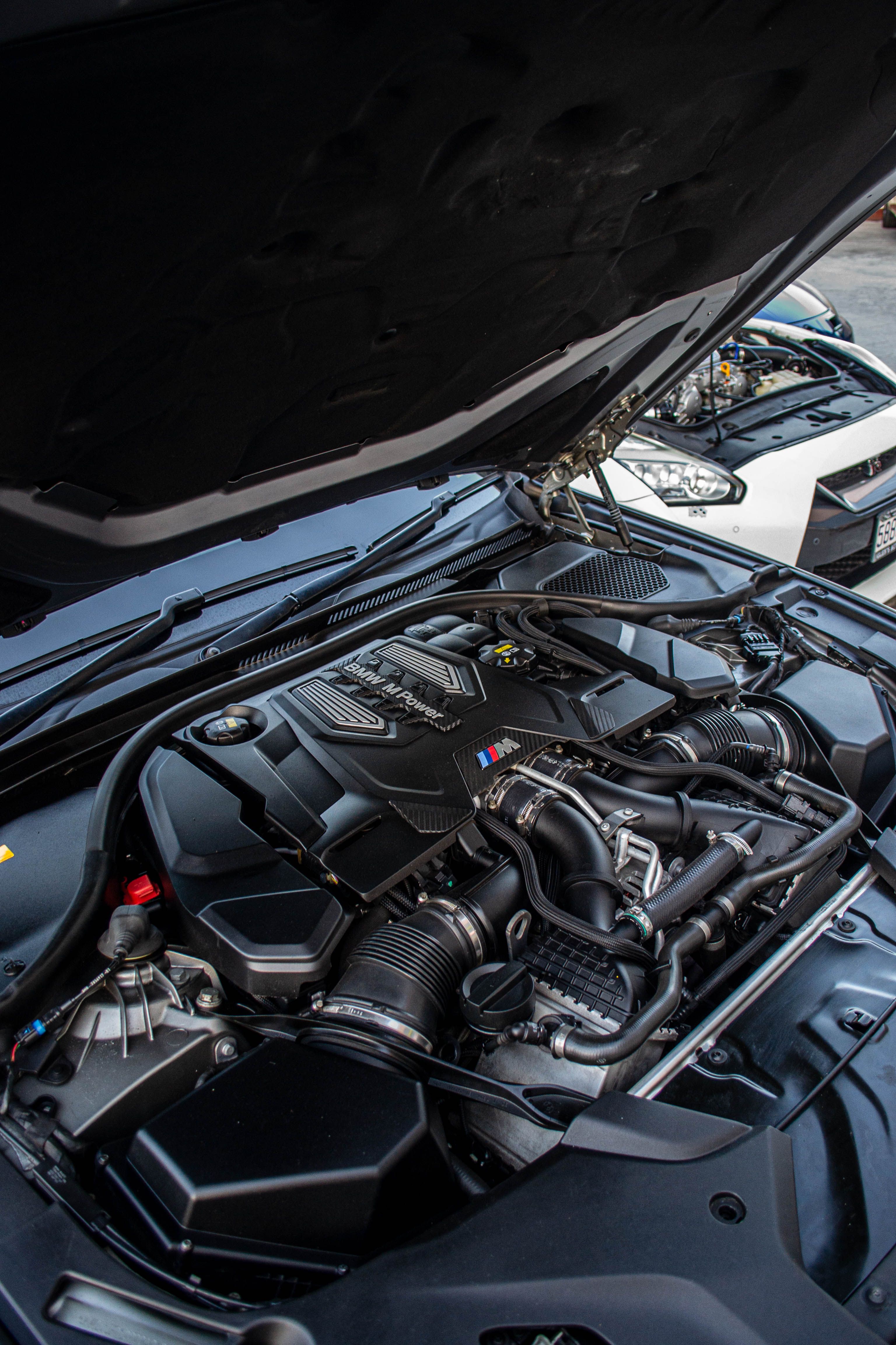 High-Performance Car Engine with Open Hood · Free Stock Photo