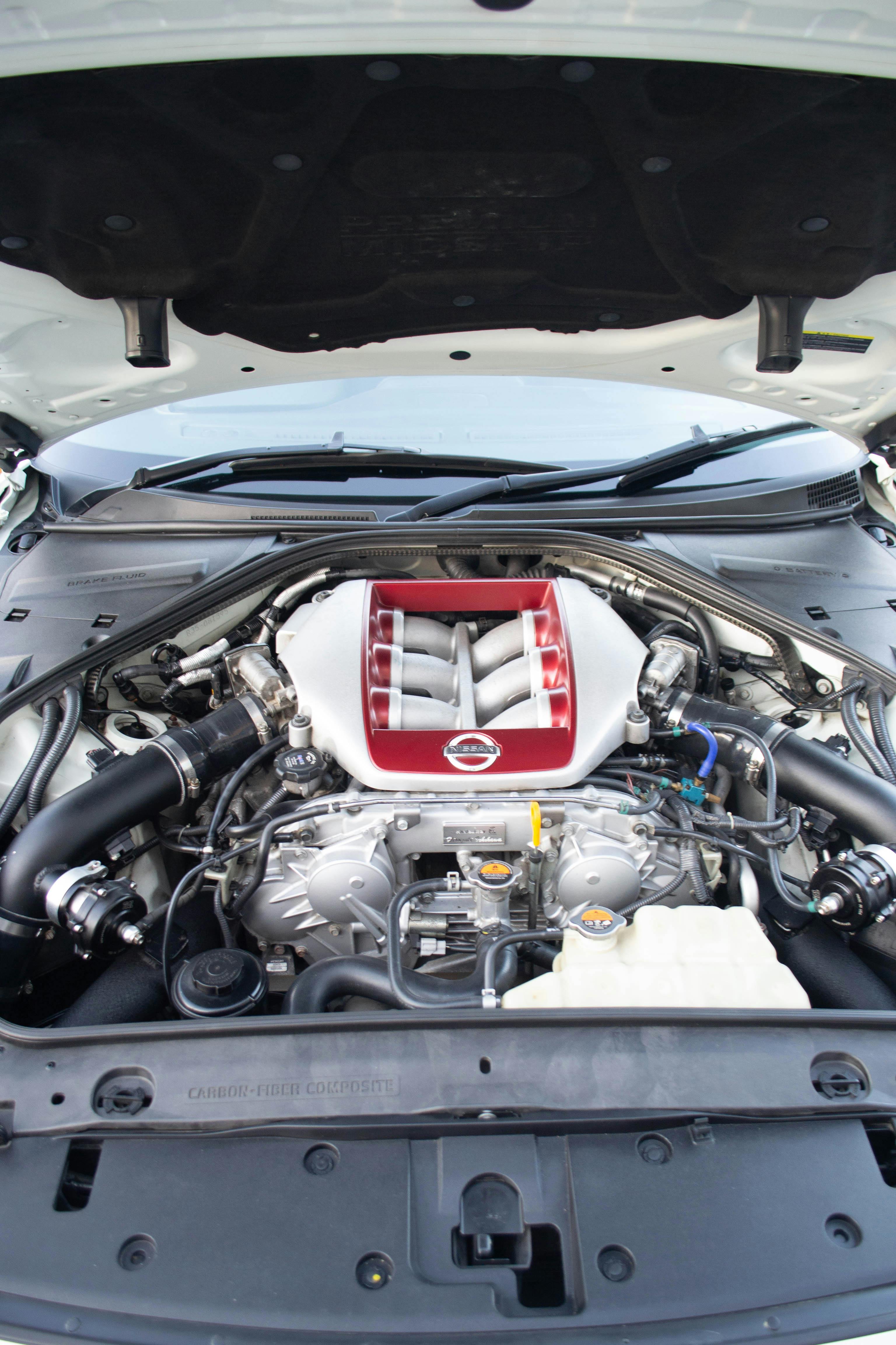 High-Performance Car Engine with Red Intake · Free Stock Photo