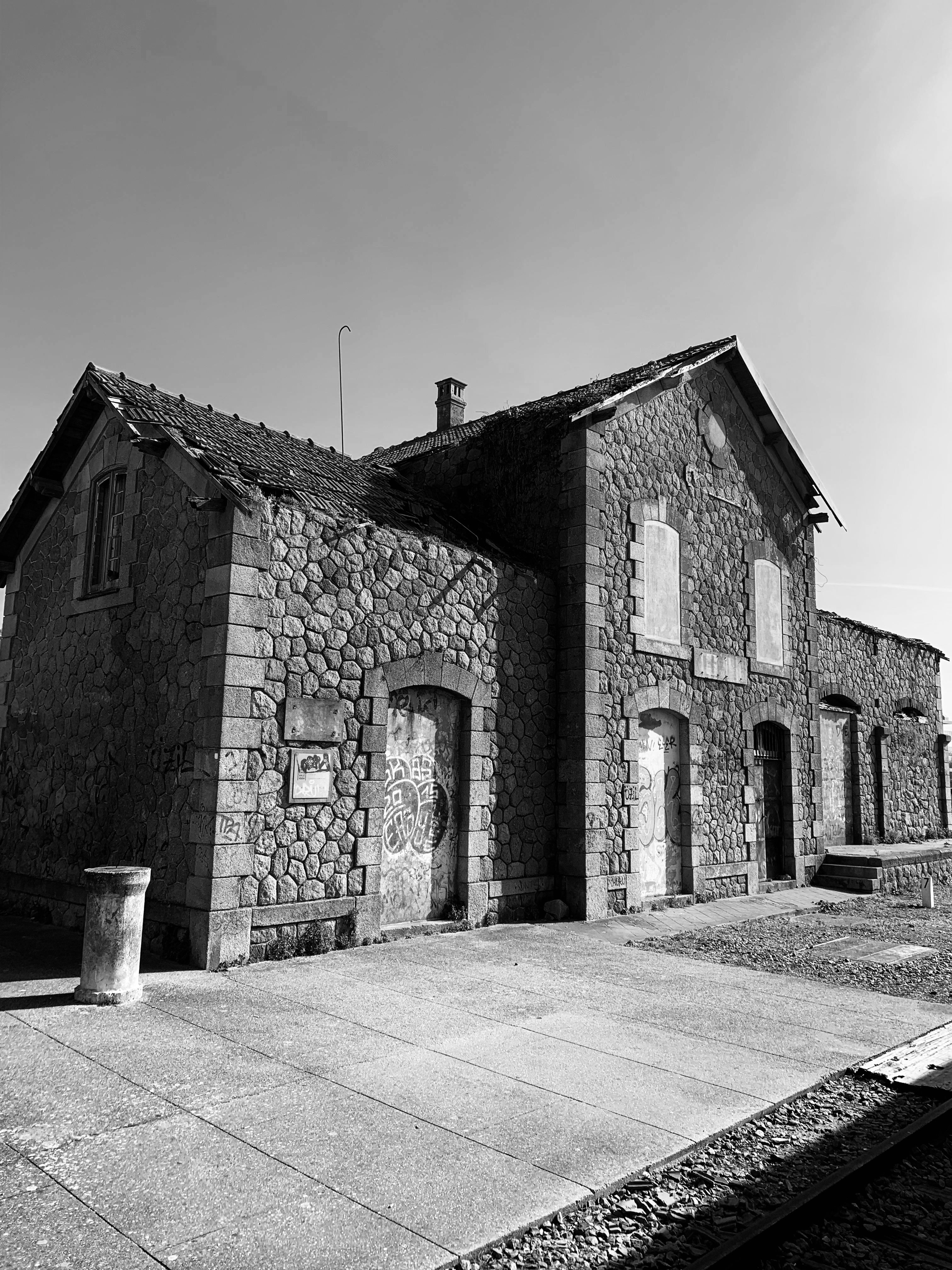 Historic Stone Railway Station in Black and White · Free Stock Photo