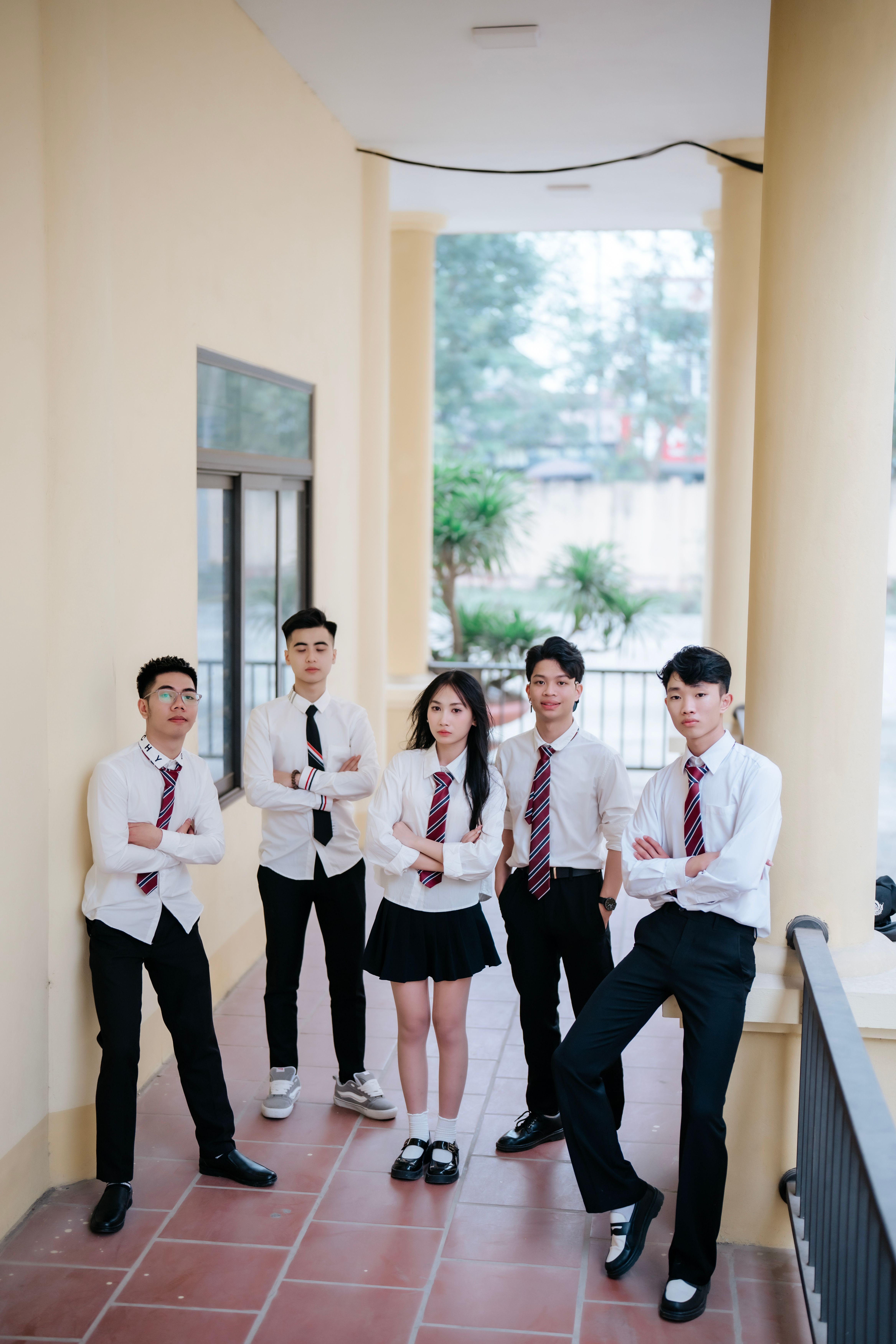 Group of Students in Uniform Posing Confidently · Free Stock Photo