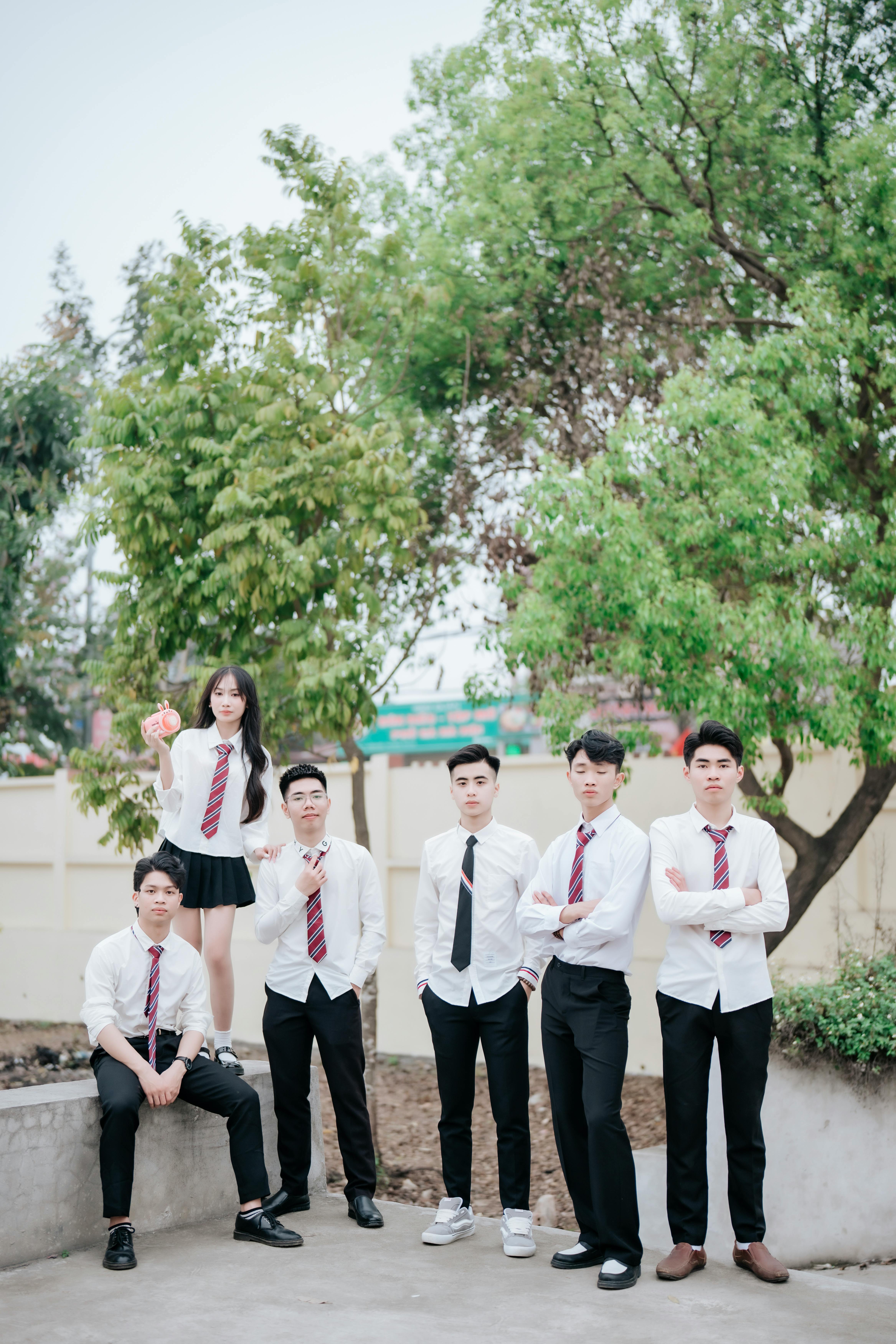 Group of Students in Uniforms Outdoors · Free Stock Photo