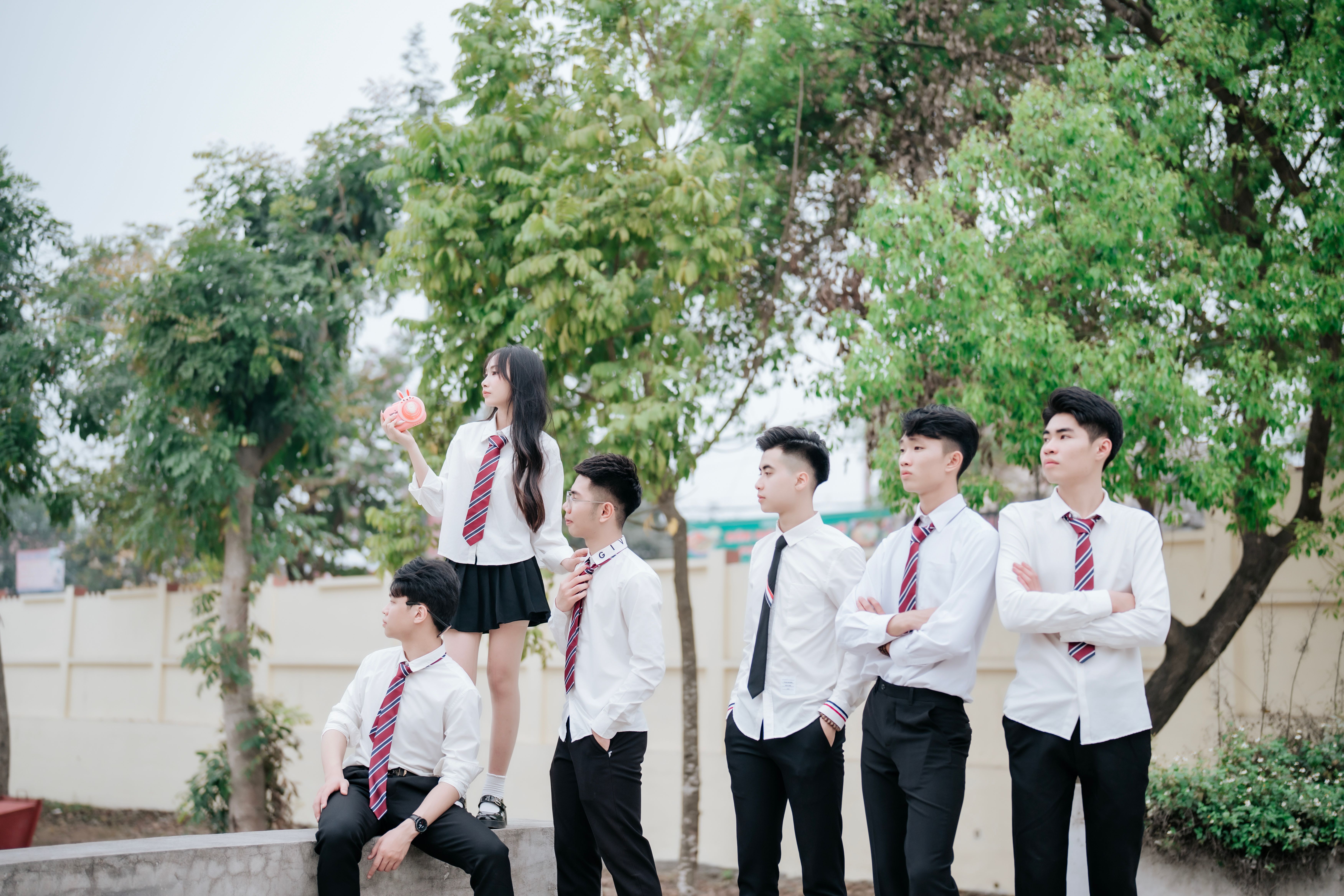 Group of Students in Uniforms Outdoors · Free Stock Photo