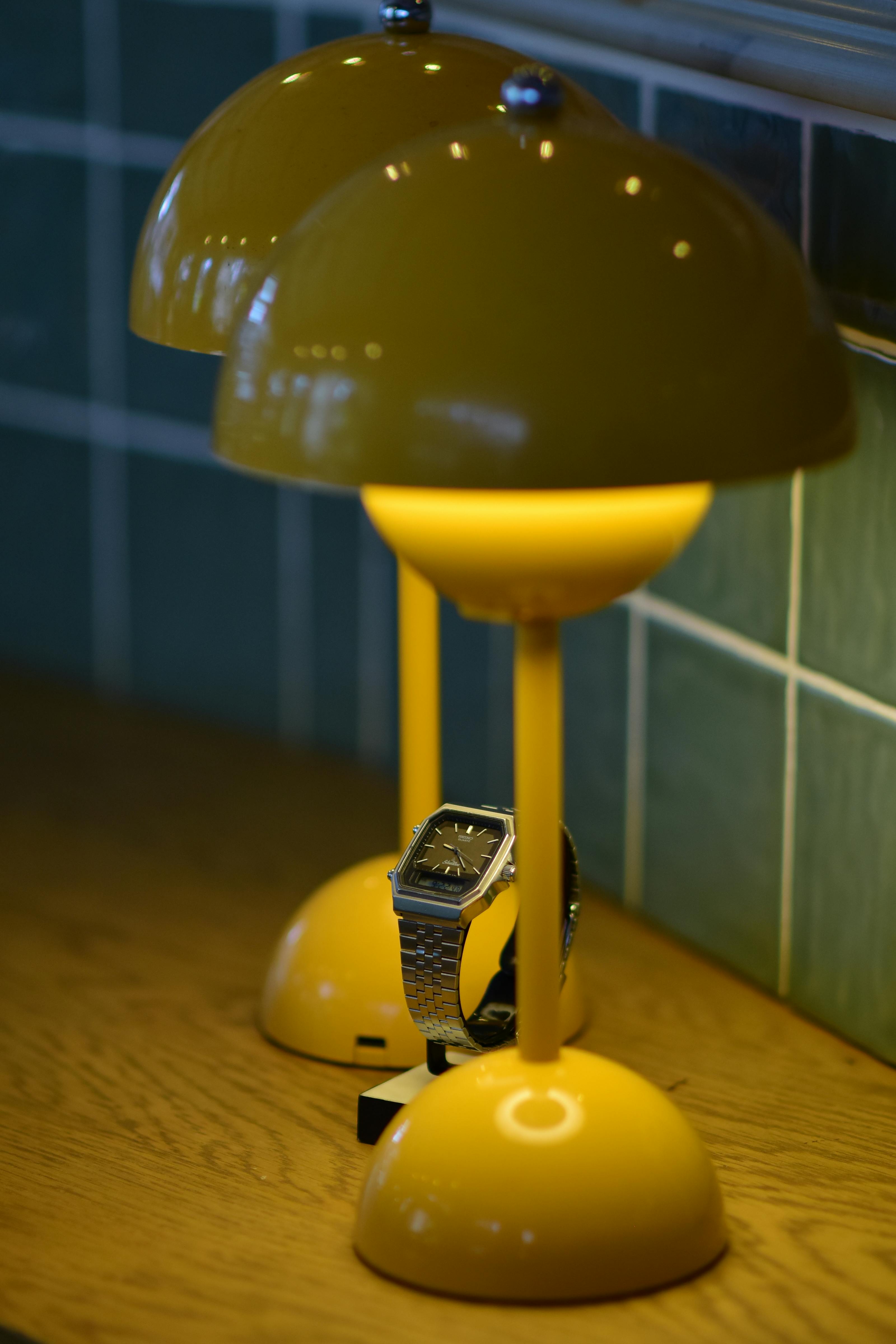 Minimalist Yellow Lamps with Modern Watch Display · Free Stock Photo