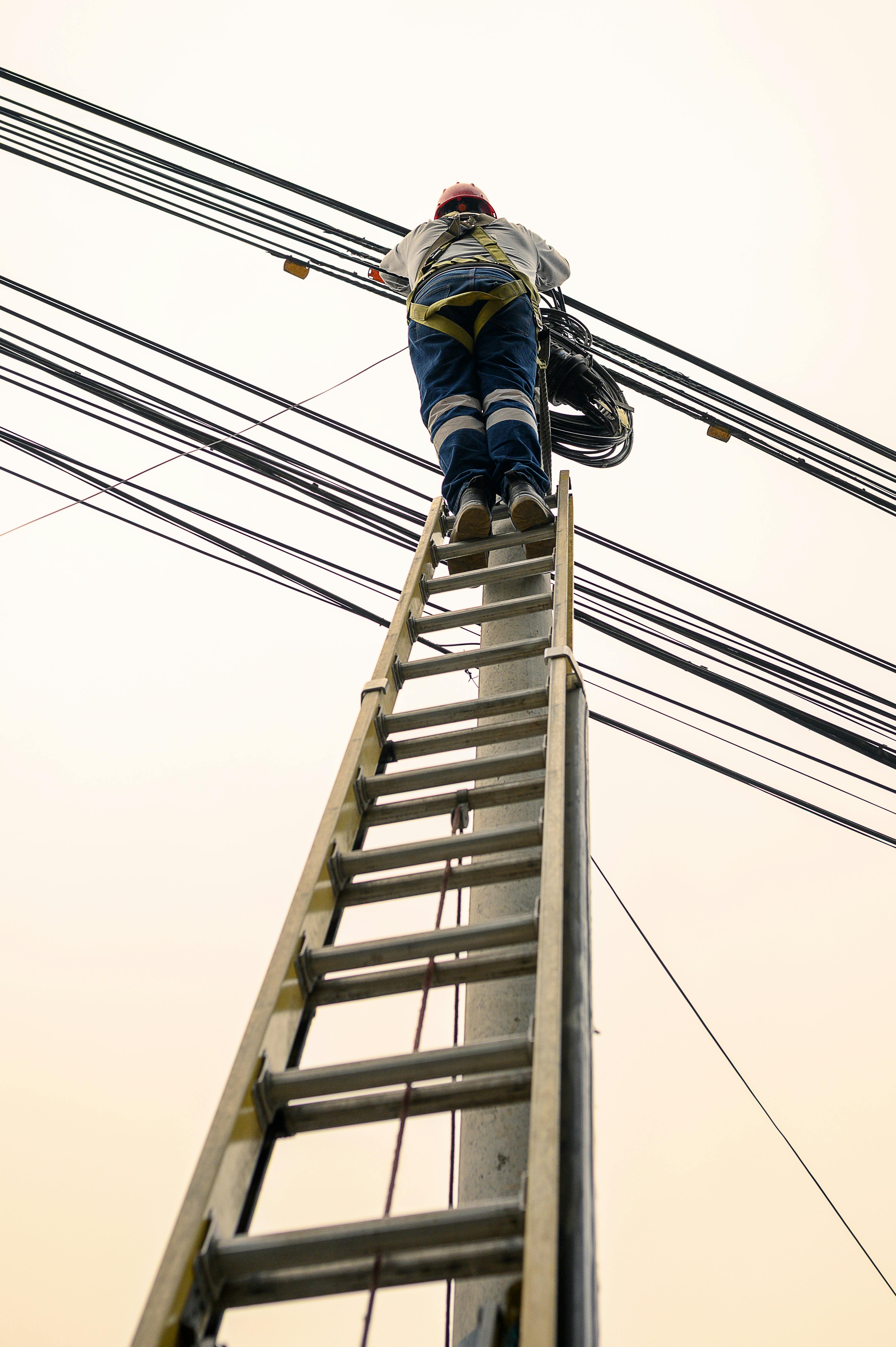 Technician Working on Power Lines in Peru · Free Stock Photo
