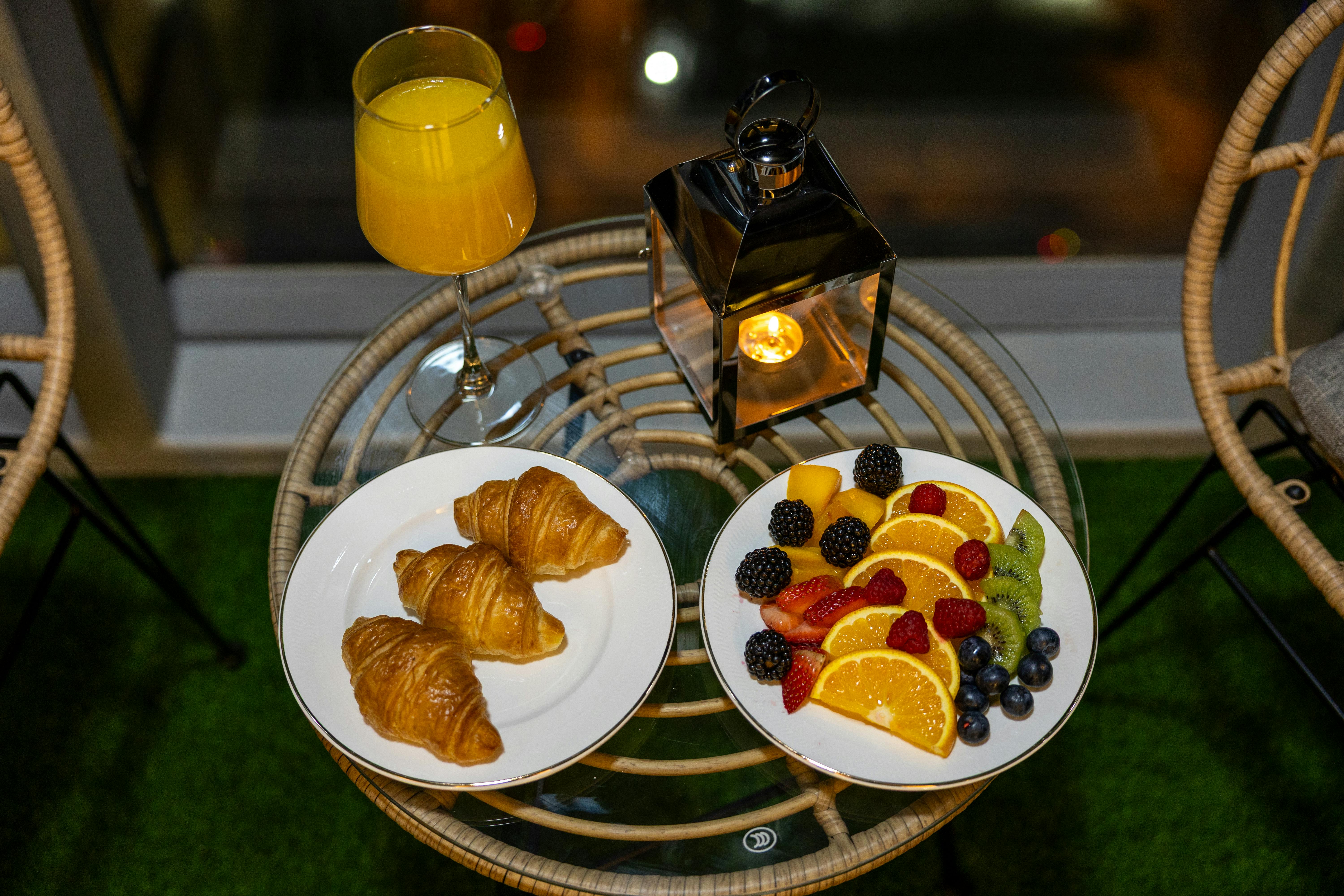 Elegant Dubai Balcony Breakfast Setup with Croissants · Free Stock Photo