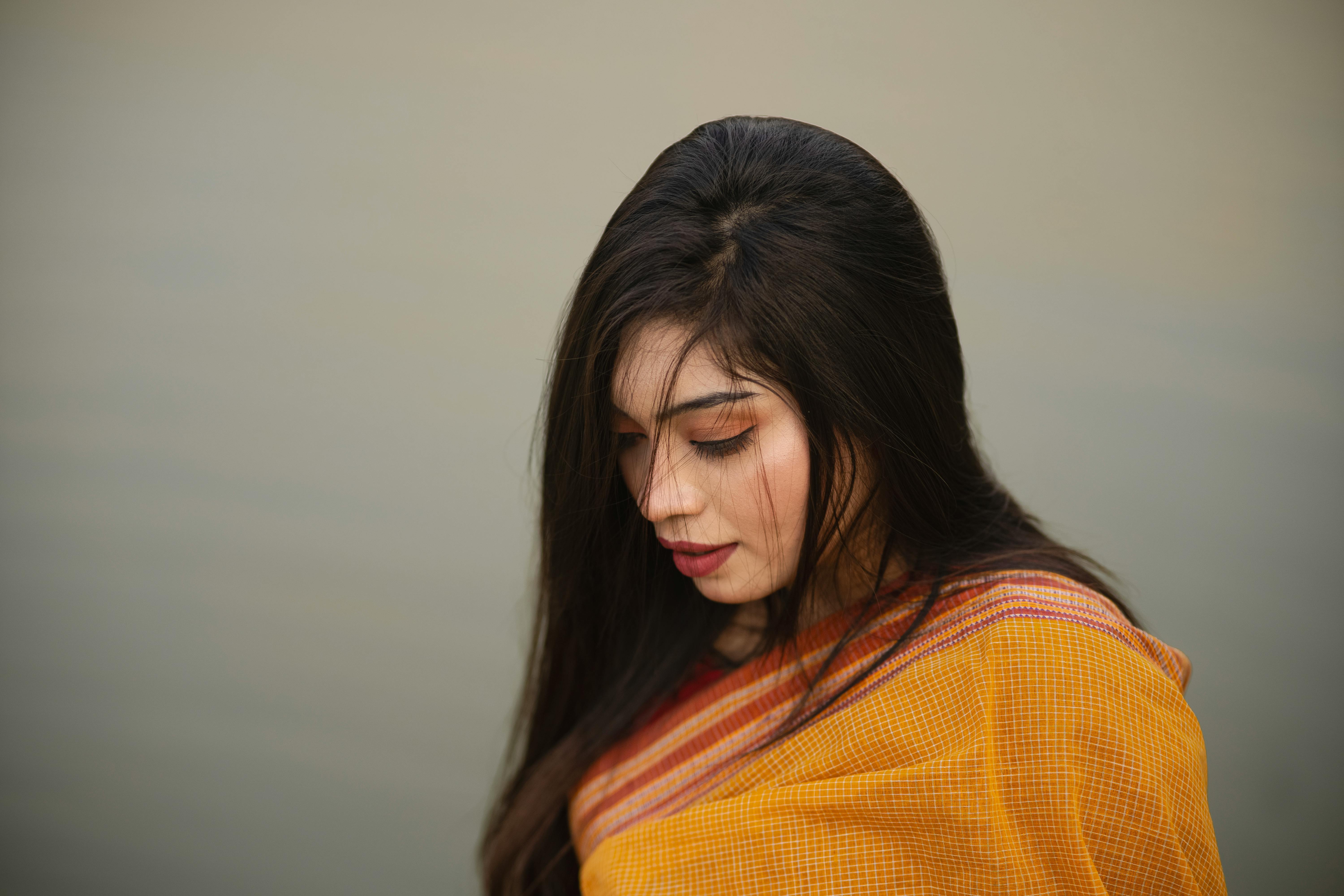 Portrait of a Woman in Traditional Yellow Sari · Free Stock Photo