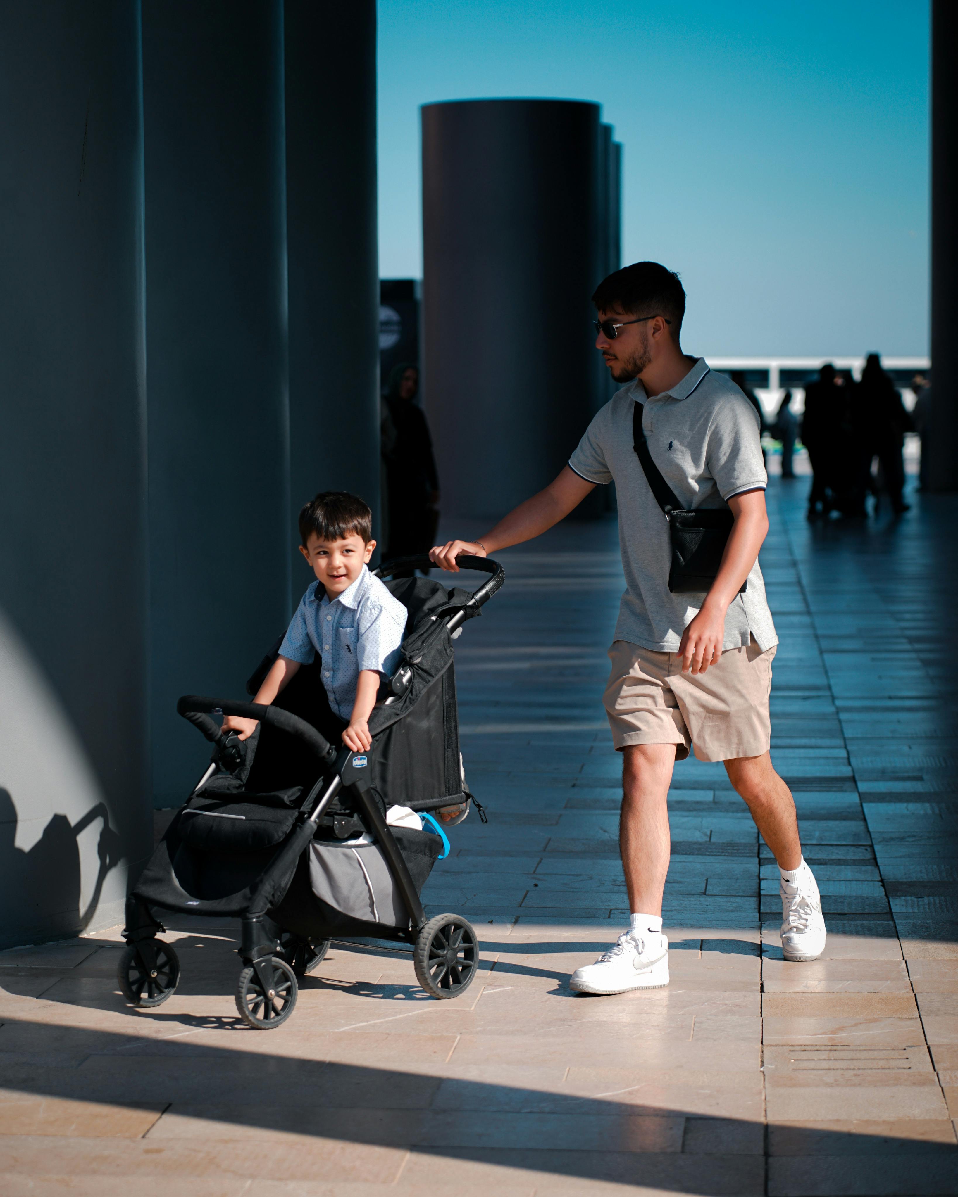 Photo of Man Pushing Baby on Stroller on Permeable Pavement · Free ...