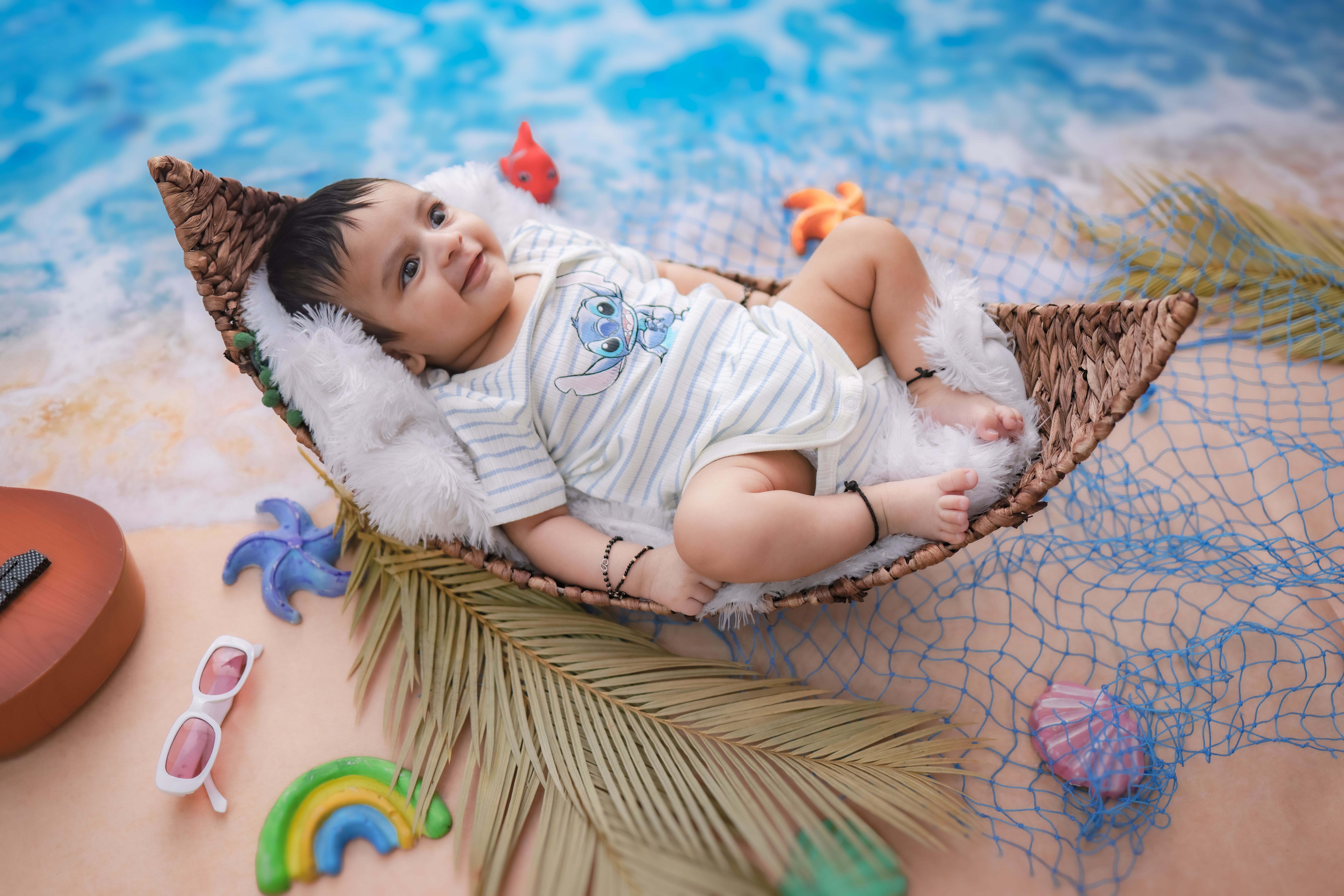 Adorable Baby Relaxing in Beach-Themed Setting · Free Stock Photo