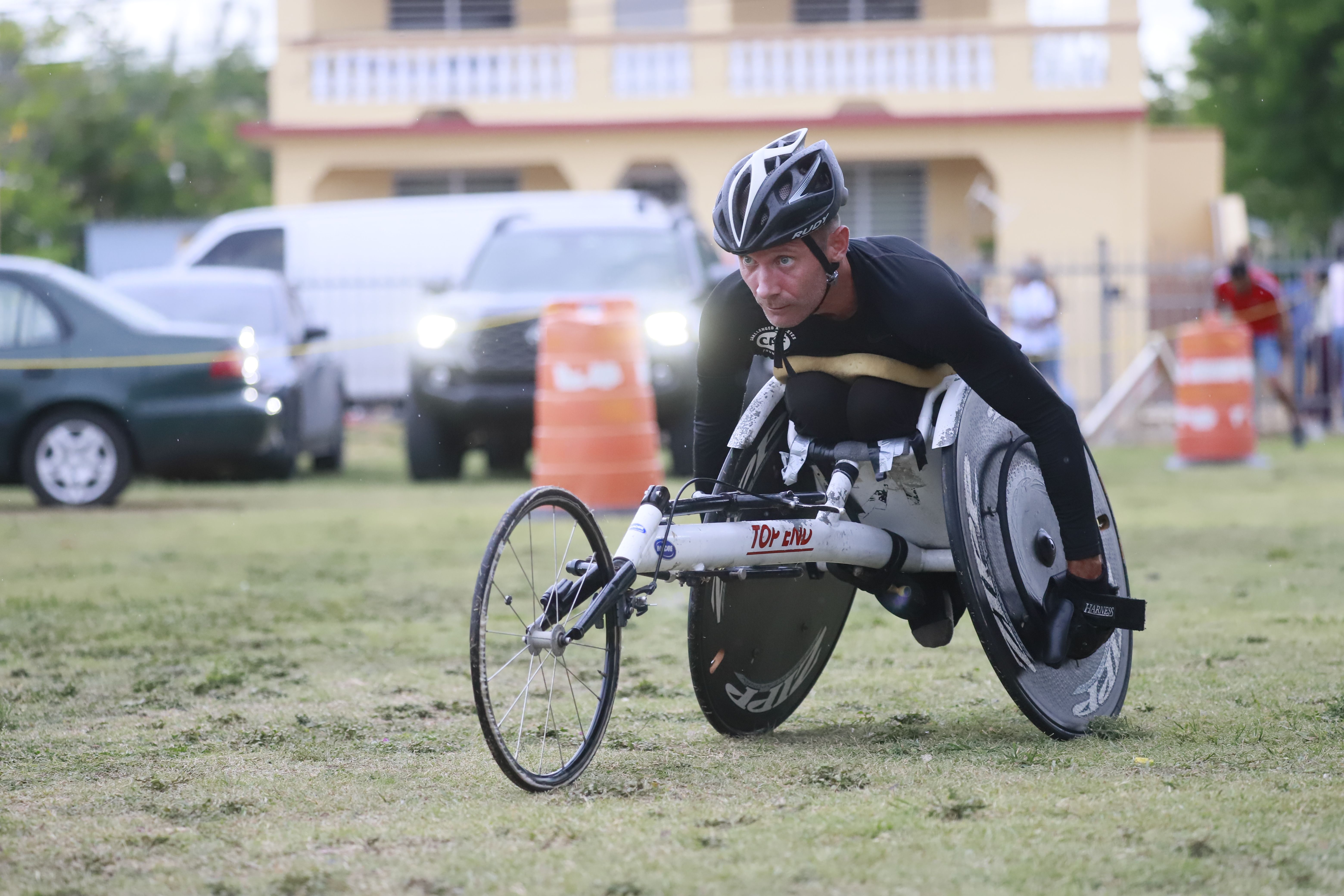 Paralympic Athlete in Racing Wheelchair Competition · Free Stock Photo