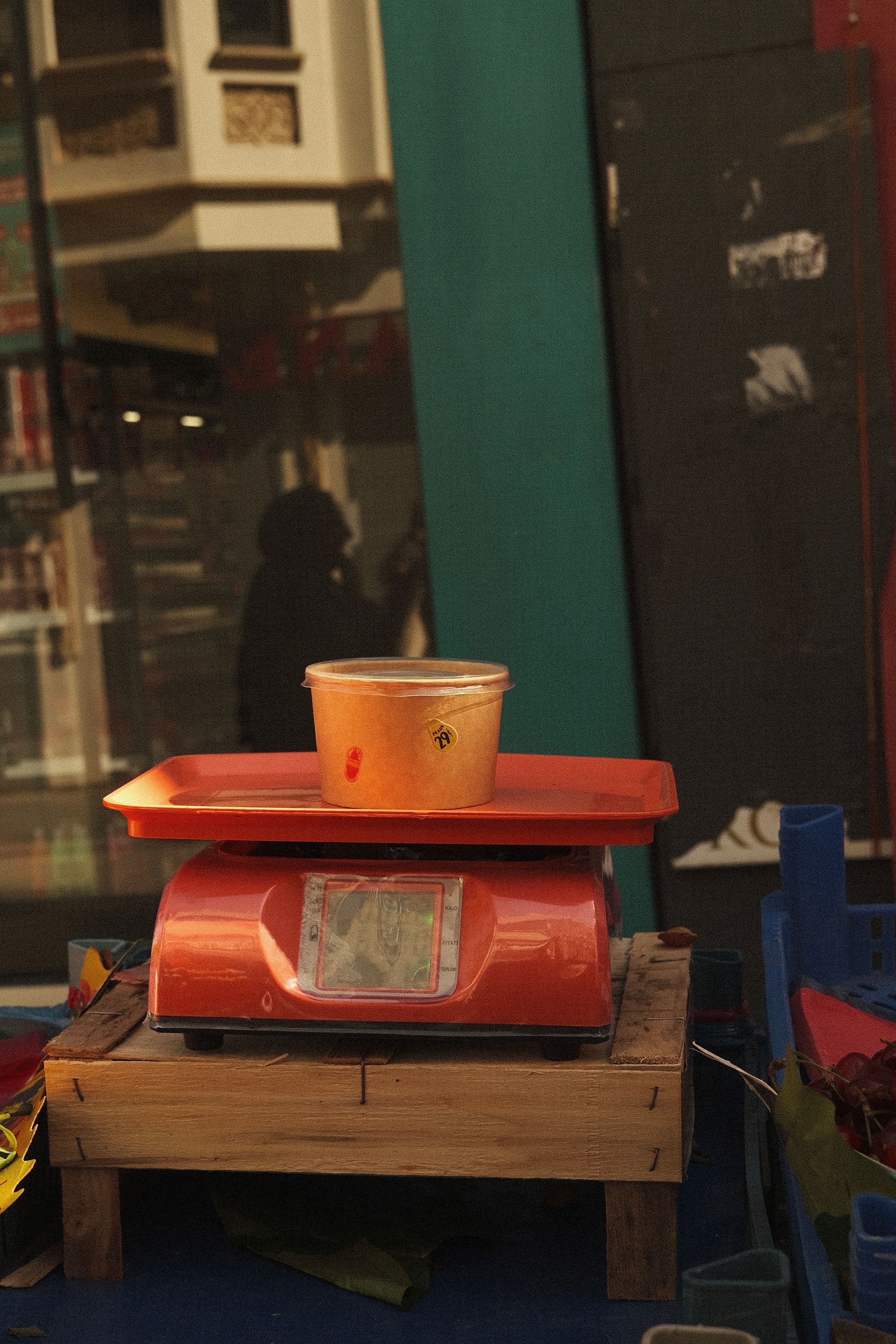 Orange Container on Market Scale · Free Stock Photo