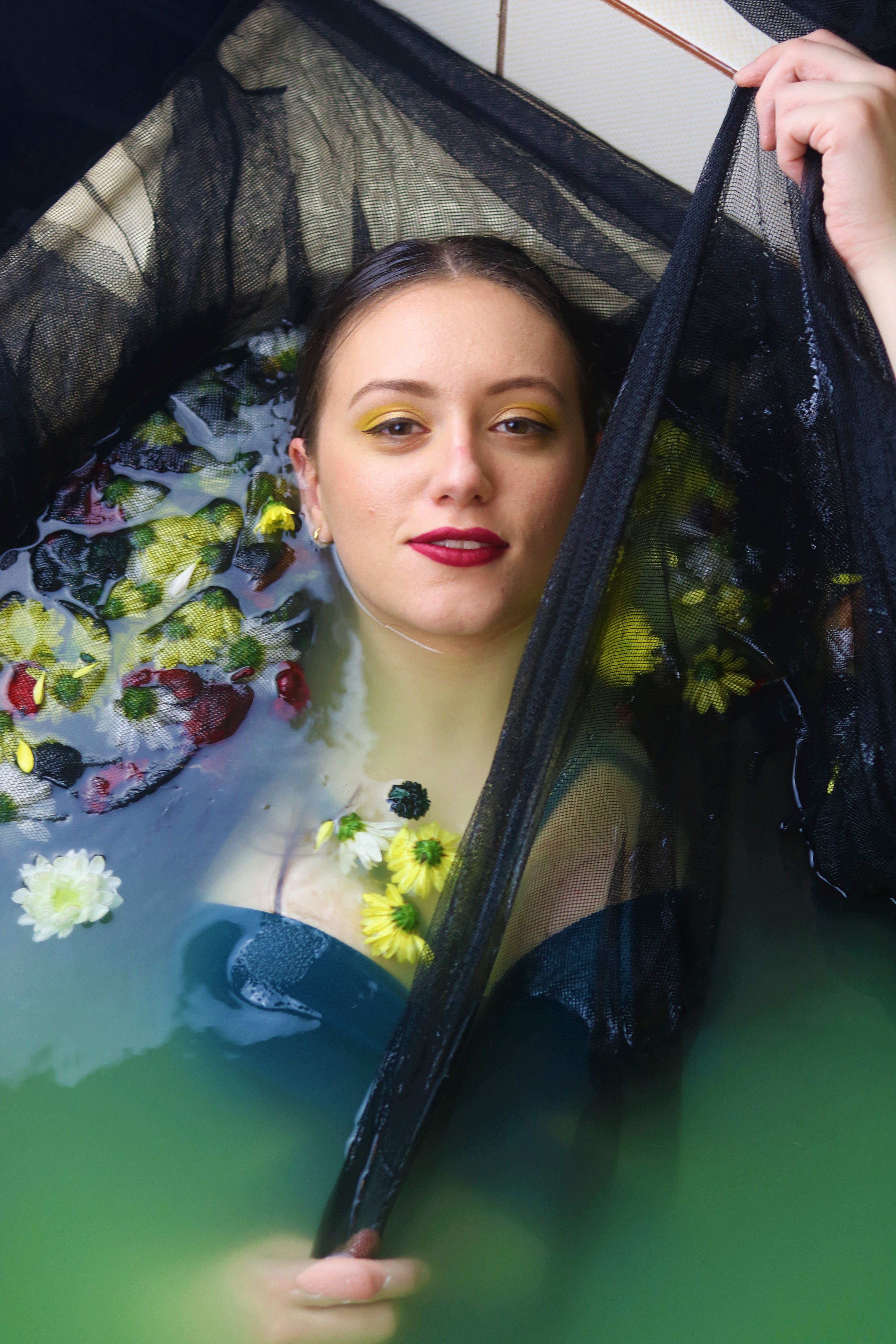 Woman Lying on Water · Free Stock Photo